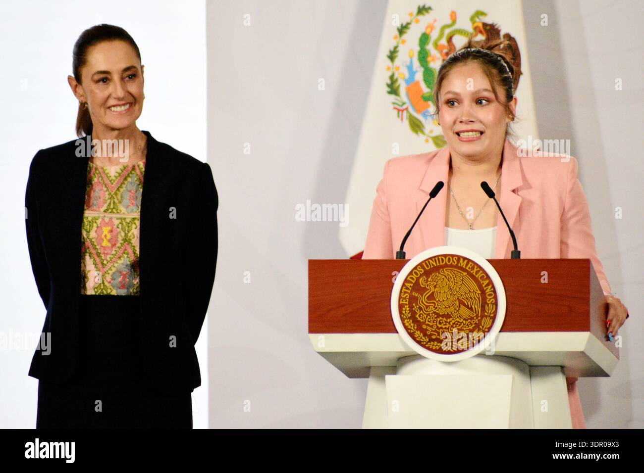 Mexico’s President Claudia Sheinbaum Pardo is seen behind while boxer ...