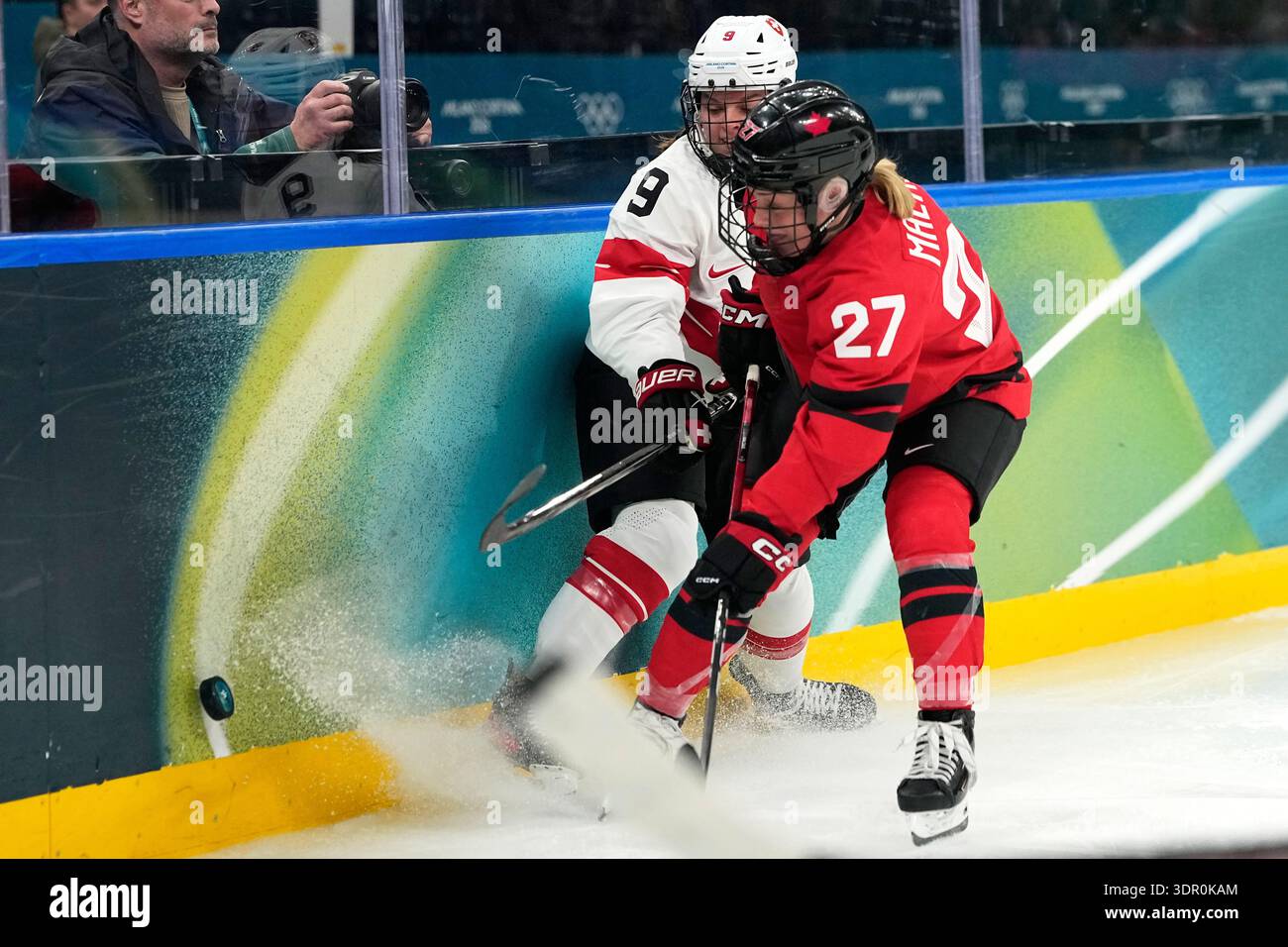 Switzerland's Shannon Sigrist (9) challenges with Canada's Emma Maltais ...
