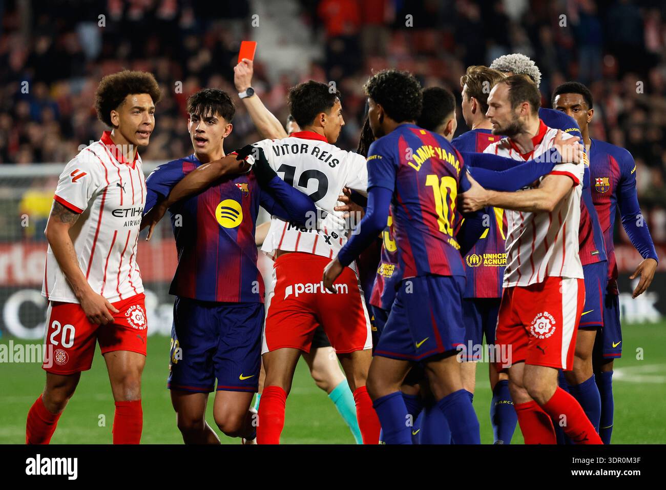 Girona's Joel Roca receives a red car during a Spanish La Liga soccer ...