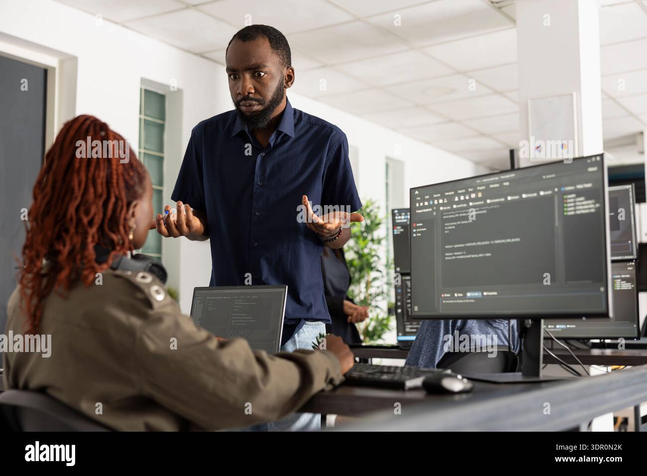 Confused man speaks colleague hi-res stock photography and images - Alamy