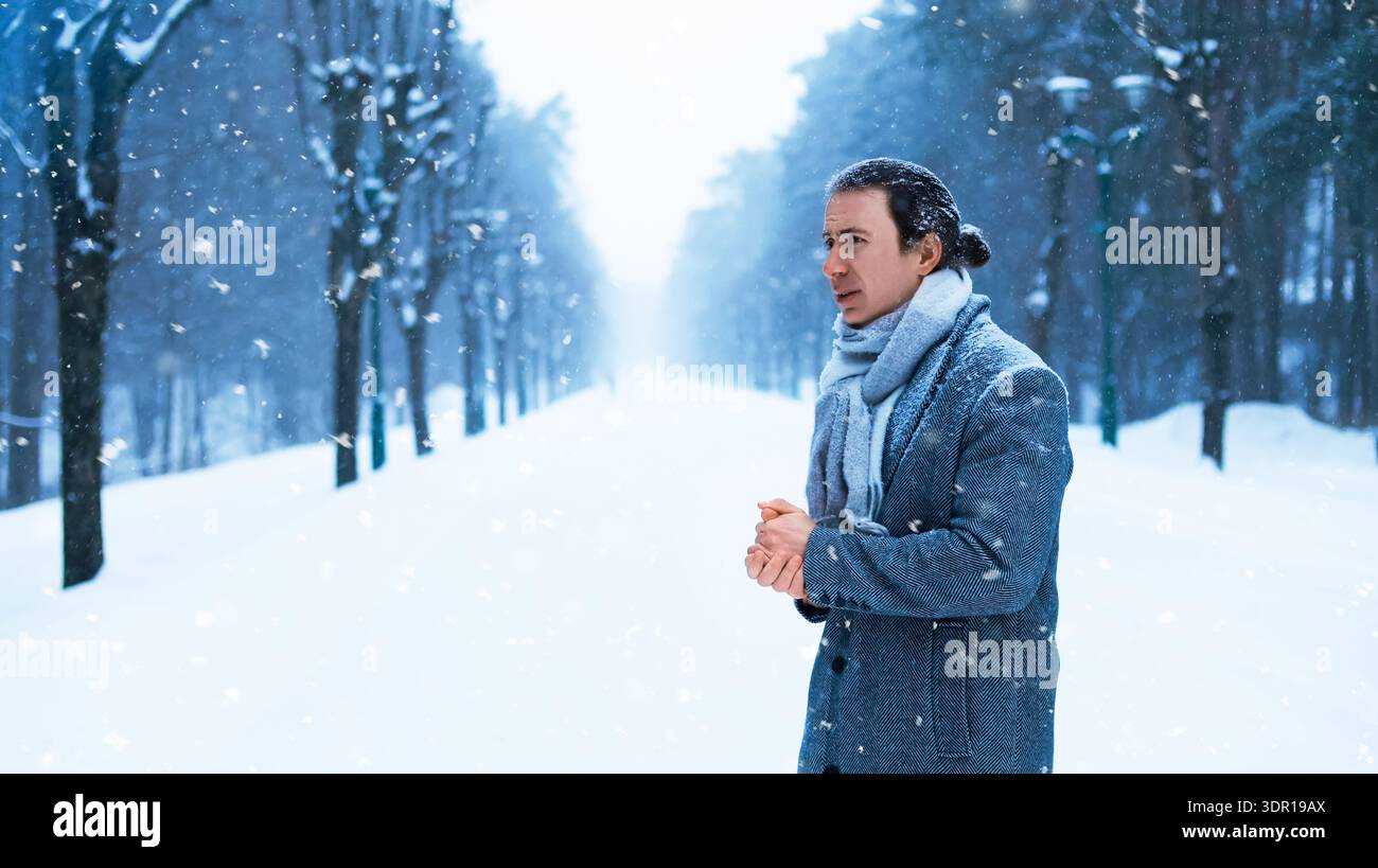 Depressed man shivering and rubbing his hands in a freezing winter park ...