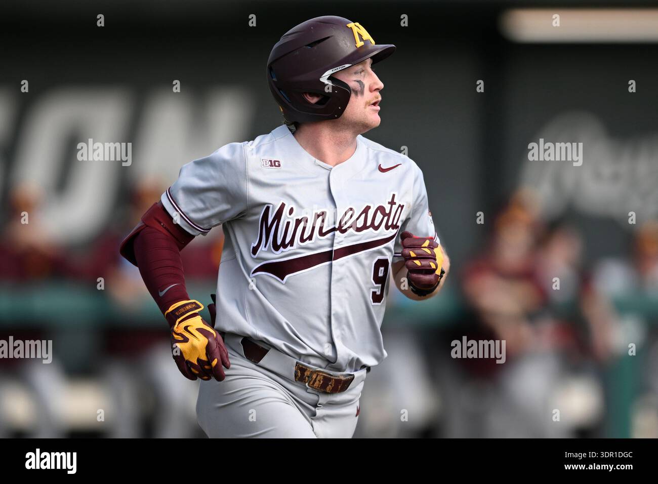 Minnesota's Davis Hamilton (9) runs after hitting a pitch during an ...