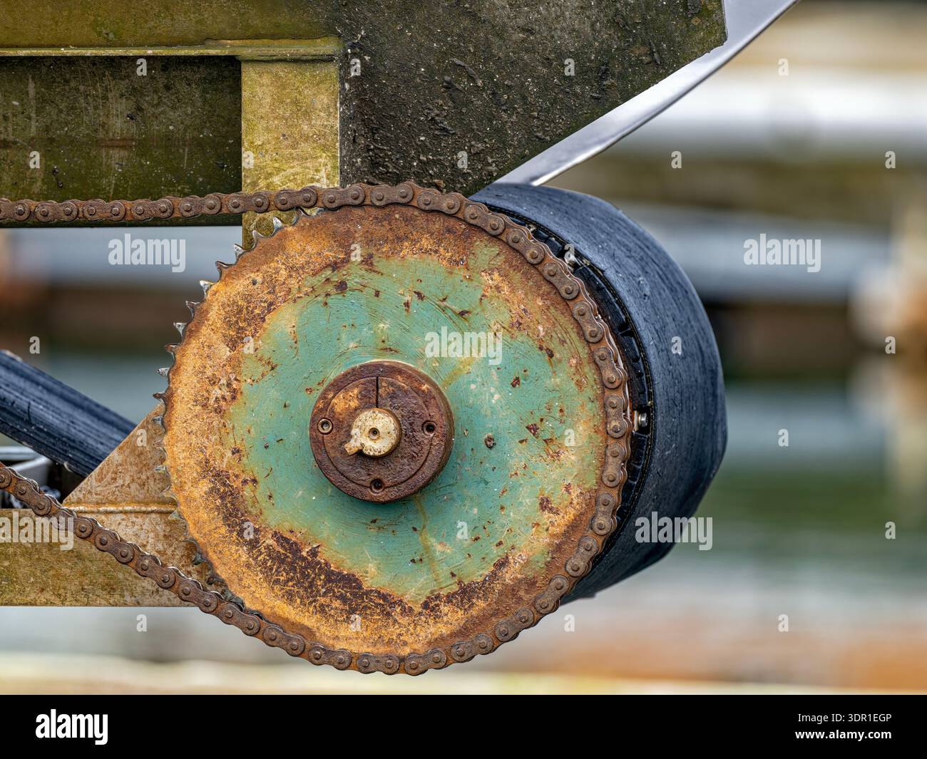 A rusted gear and pulley conveyor mechanism on a commercial fishing ...