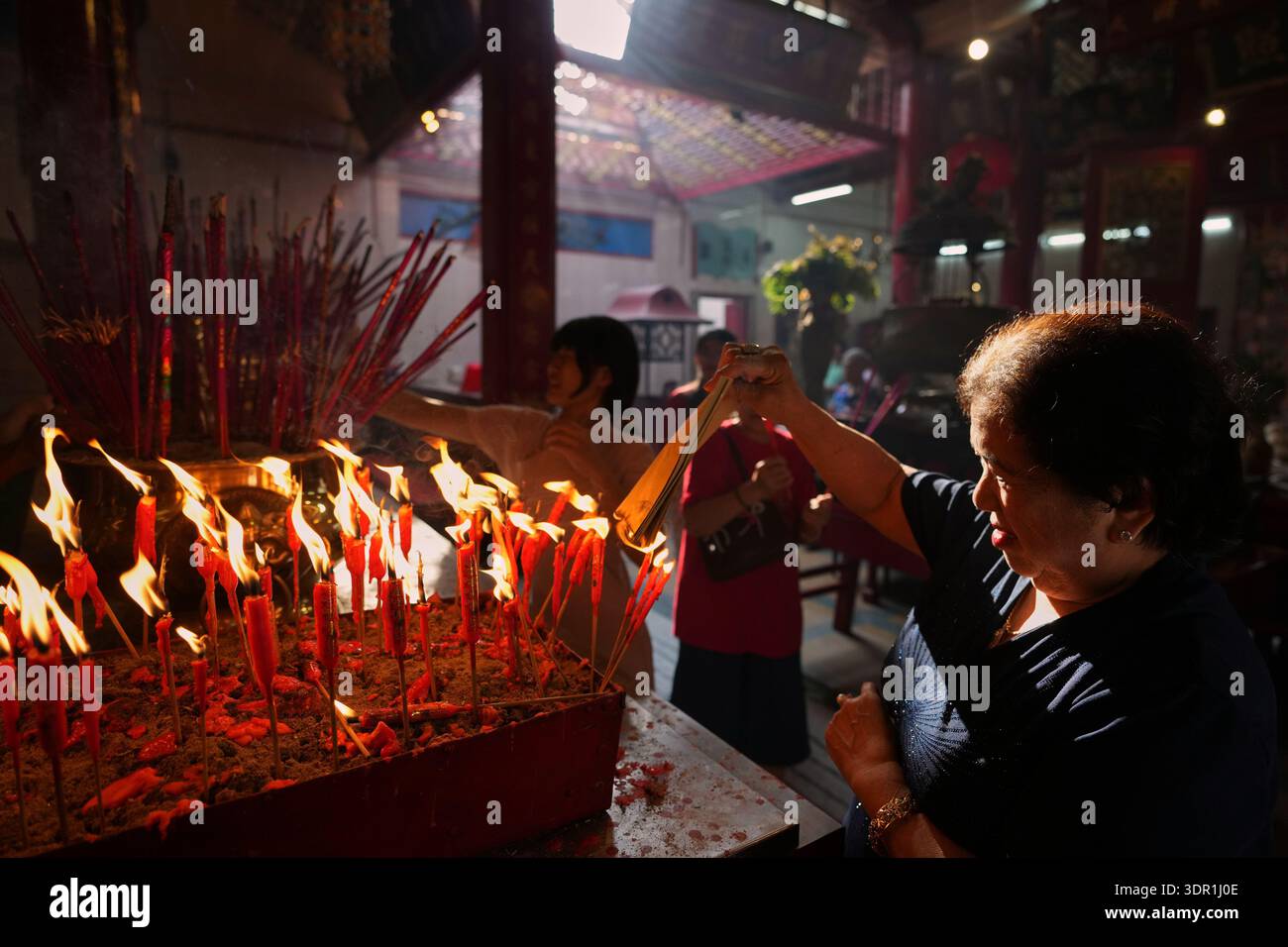 Chinese people pray at a temple during Lunar New Year celebrations at ...