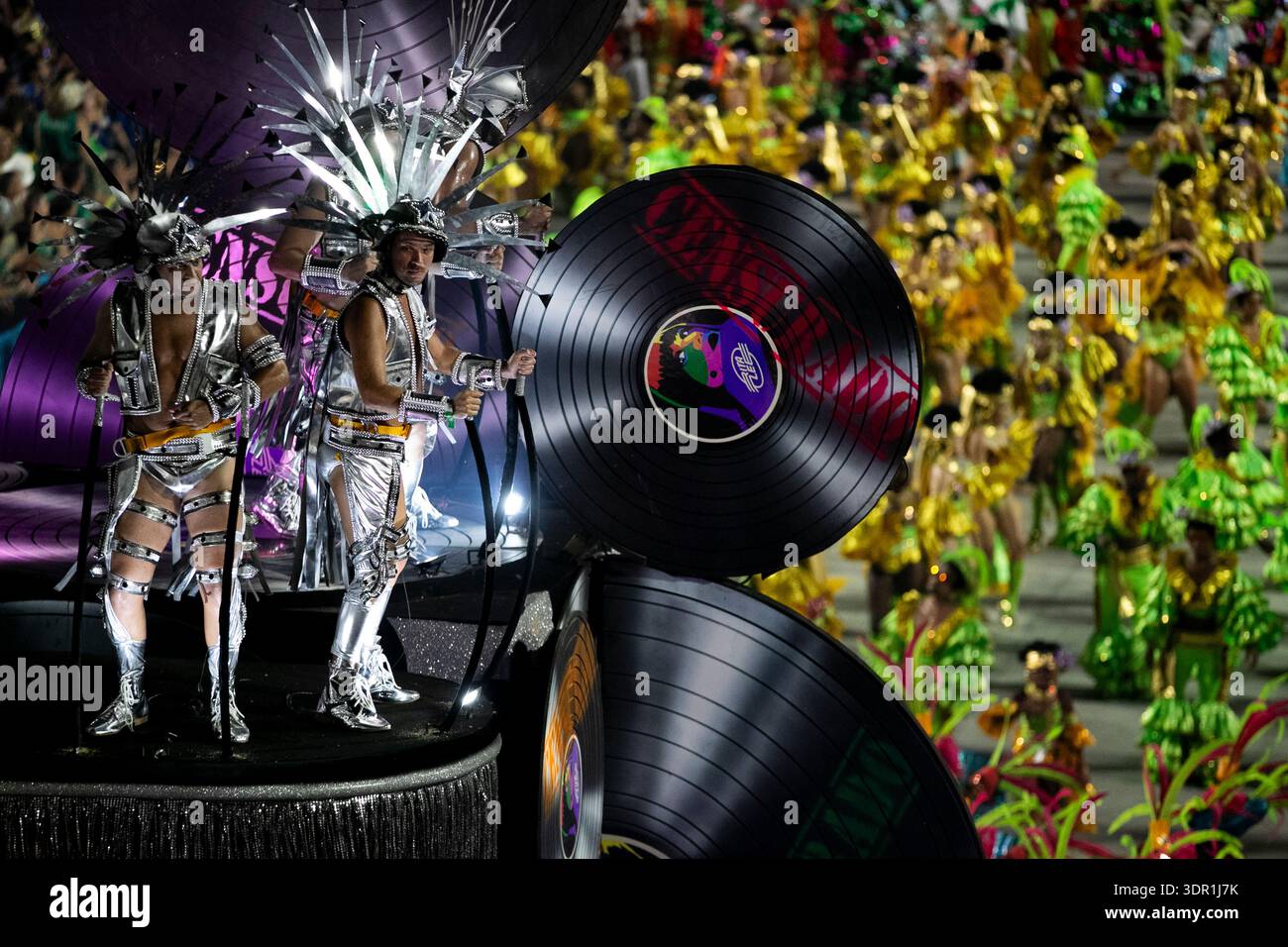 Performers from the Mocidade samba school parade on a float during ...