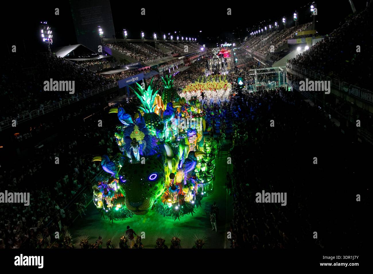 Performers from the Mocidade samba school parade on a float during ...