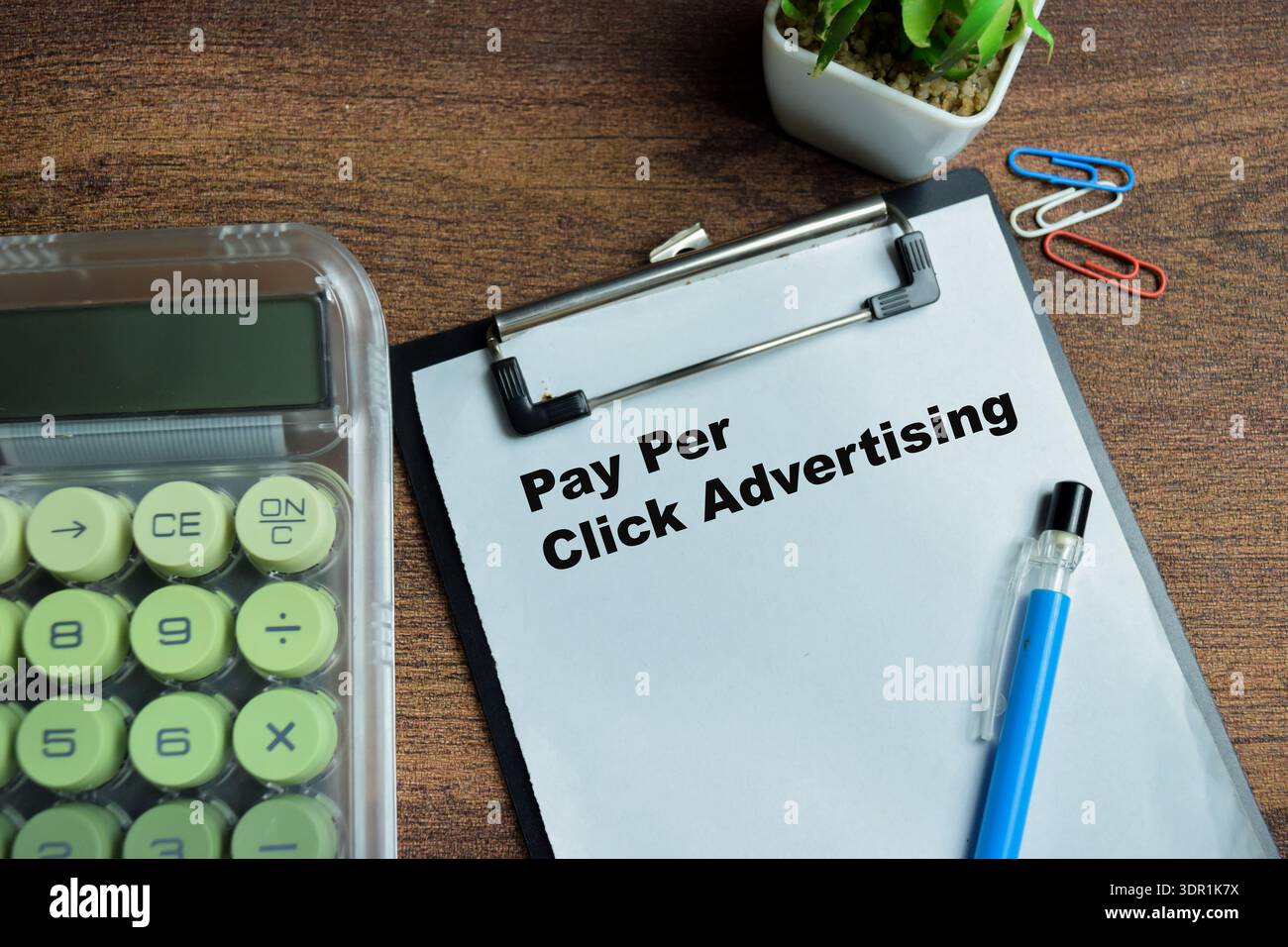 Concept of pay per click by advertising write on clipboard isolated on ...