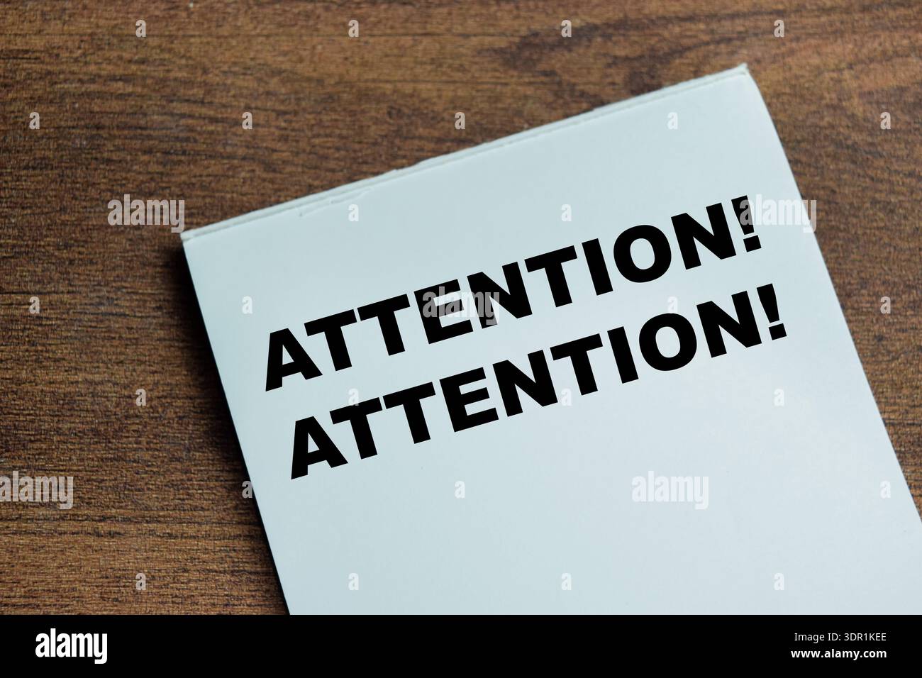 Concept of attention write on book isolated on Wooden Table Stock Photo ...