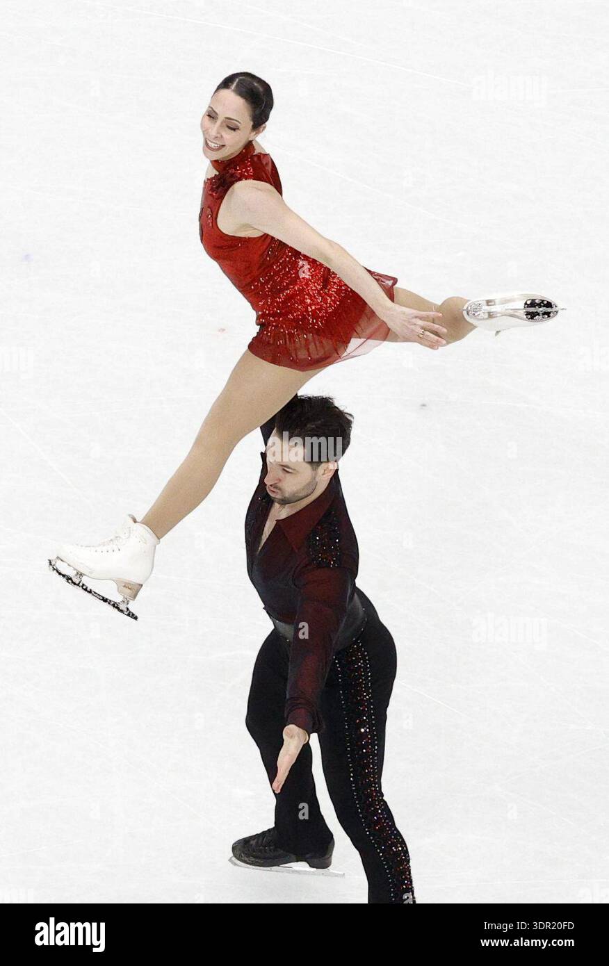 Deanna Stellato-Dudek (top) and Maxime Deschamps of Canada perform in ...