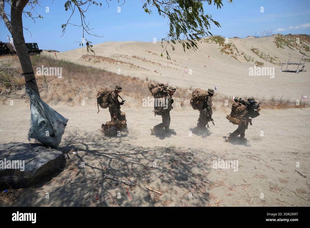 FILE -U.S. troopers in battle gear walk during a joint military ...