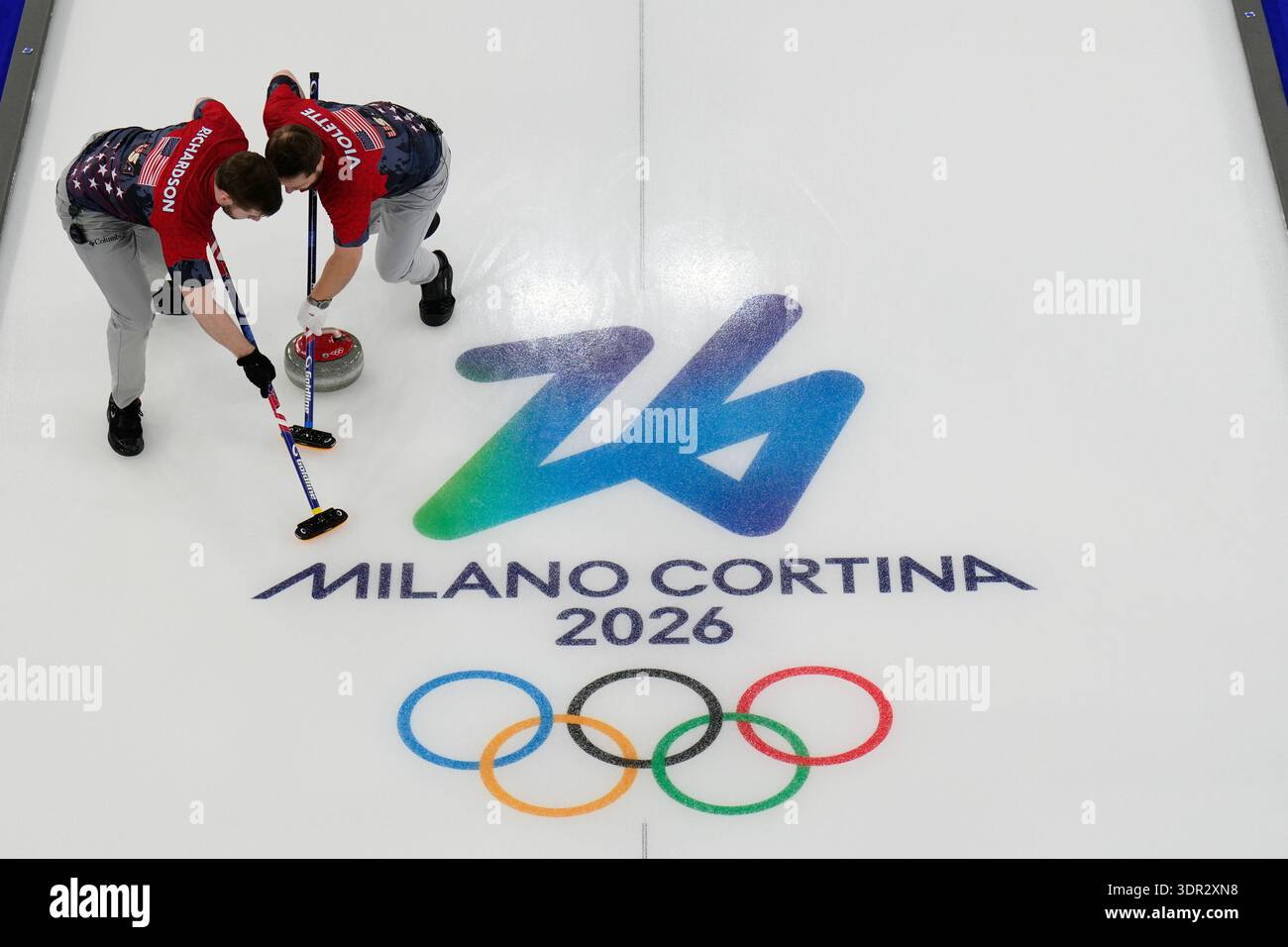 United States' Luc Violette and Ben Richardson sweep ahead of a stone ...