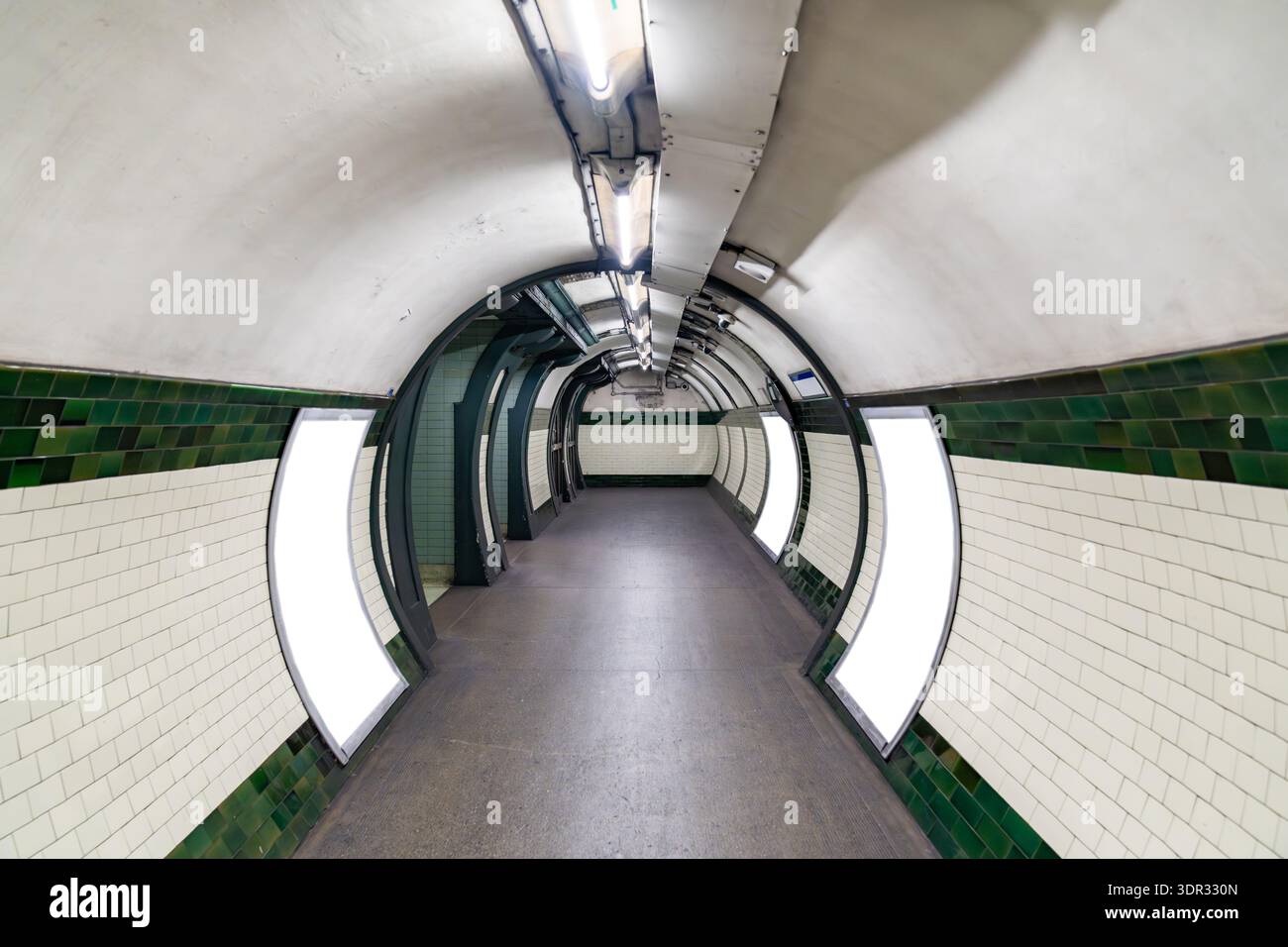 Curved wall advertising space inside underground subway station ...