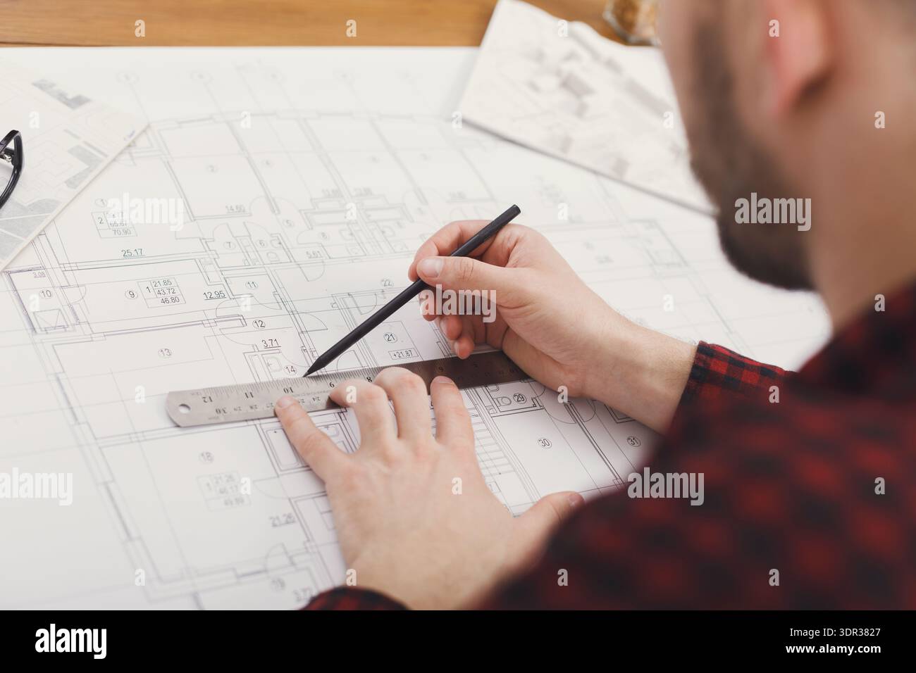 Man sketches building plans hi-res stock photography and images - Alamy