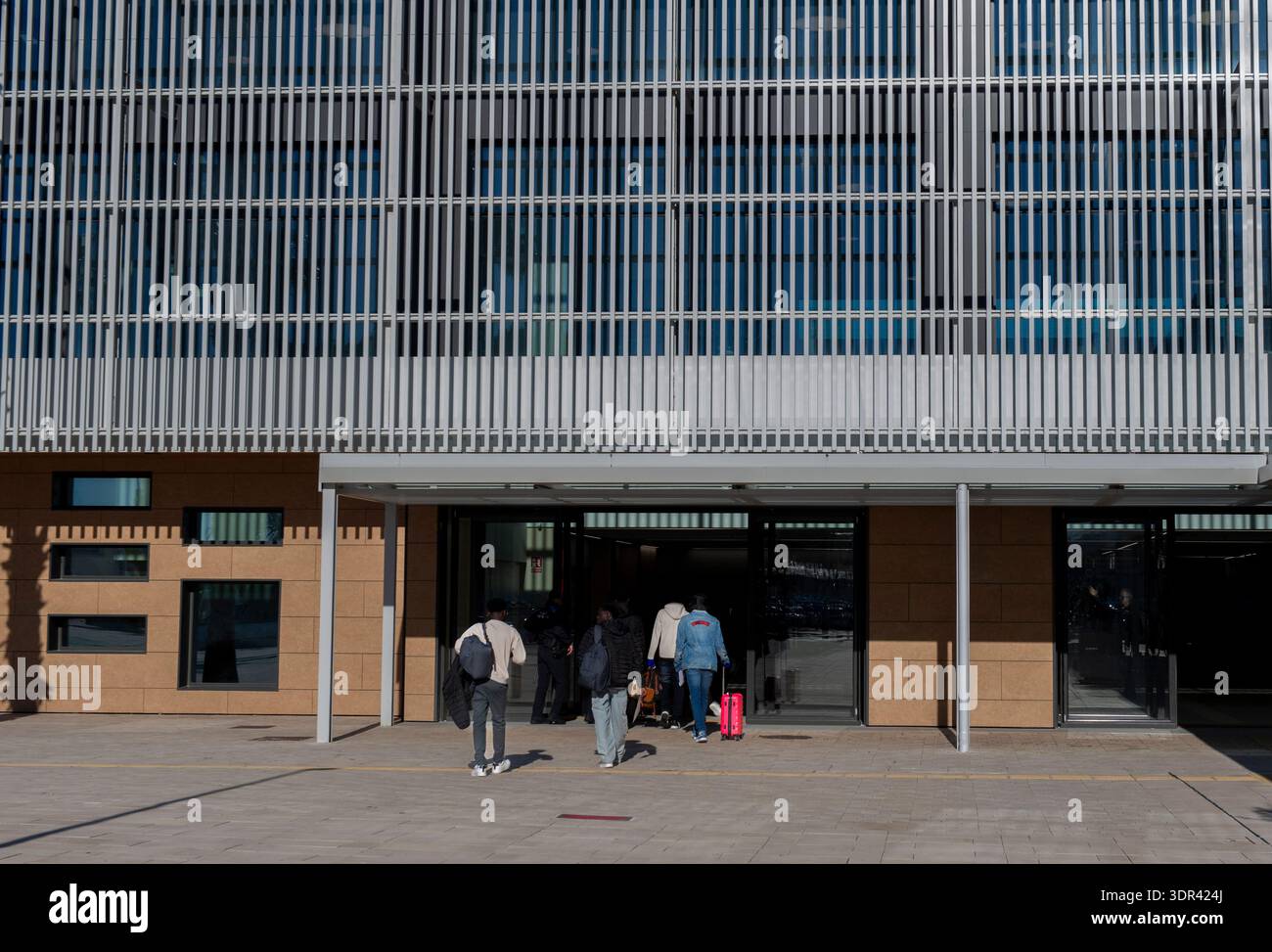 Several people leaving the Temporary Stay Centre for Immigrants (CETI ...