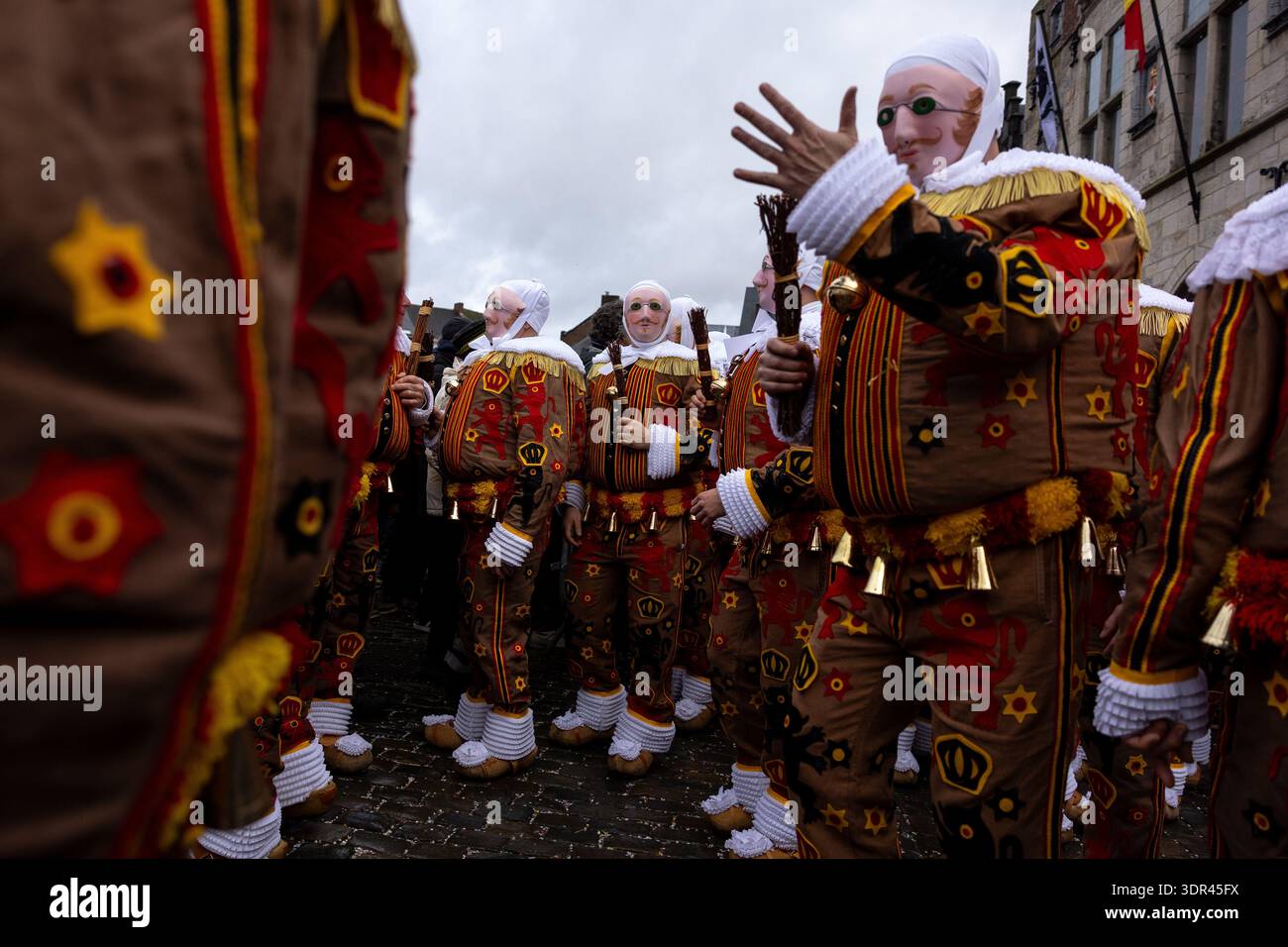 The Gilles of Binche wear their traditional wax masks as they attend ...