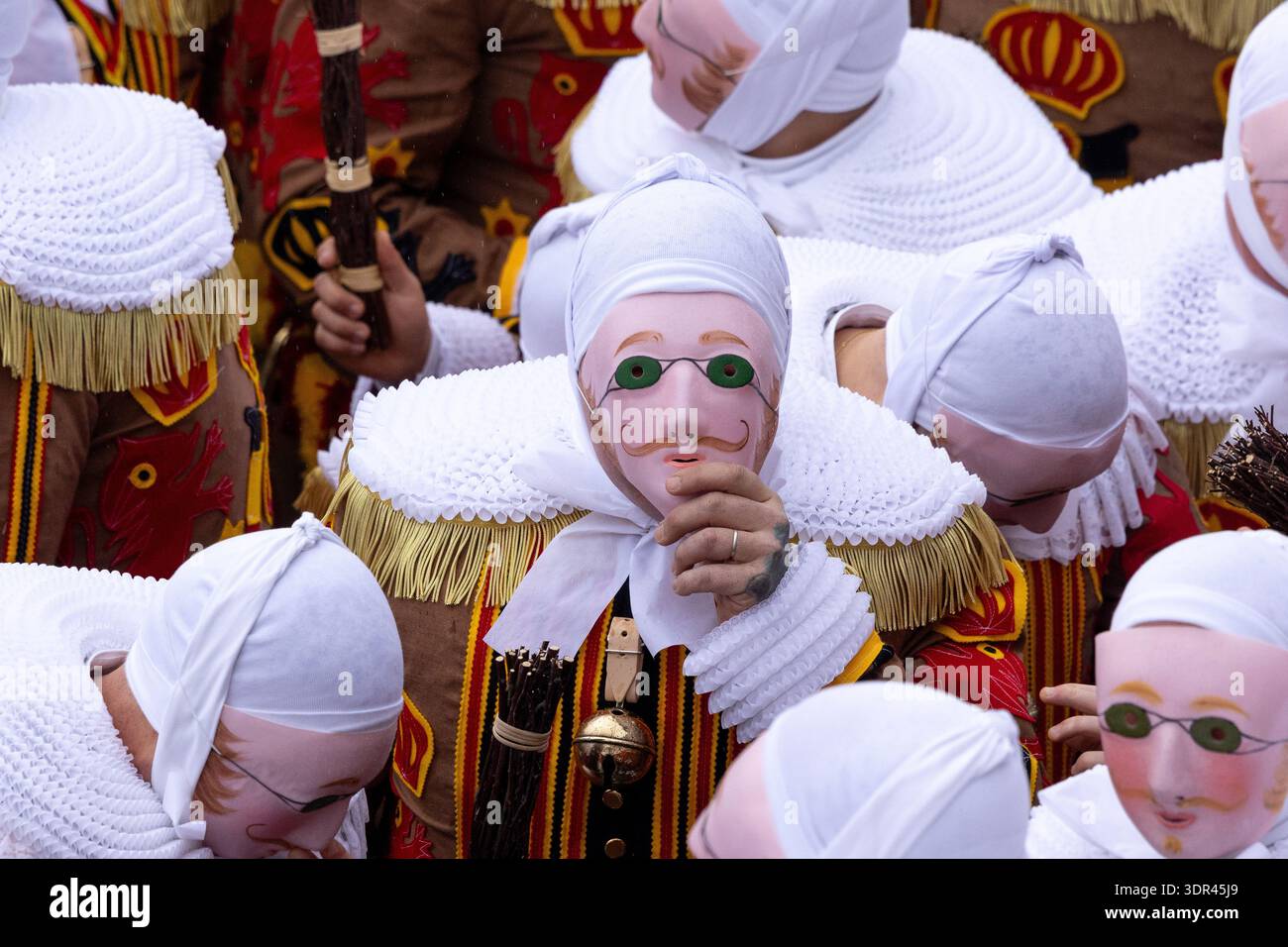 The Gilles of Binche wear their traditional wax masks as they attend ...