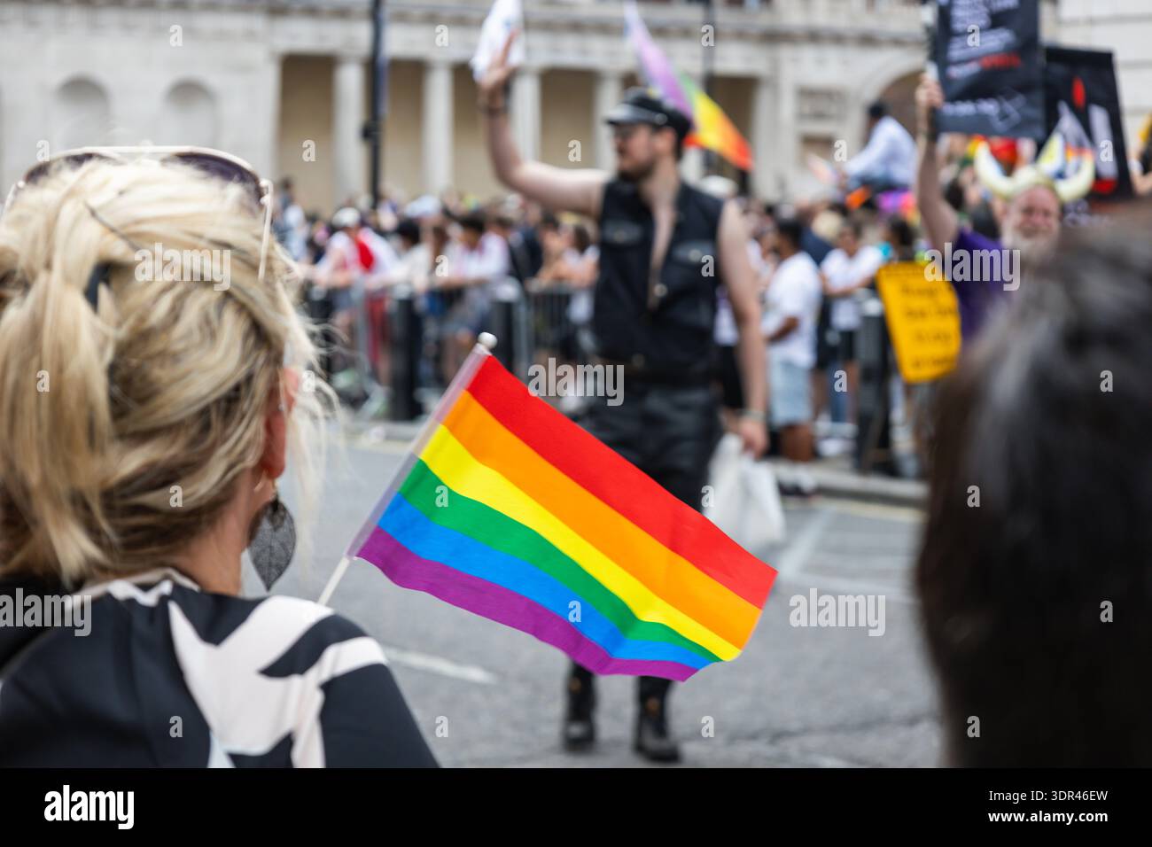Inclusive pride parade waving flag hi-res stock photography and images ...