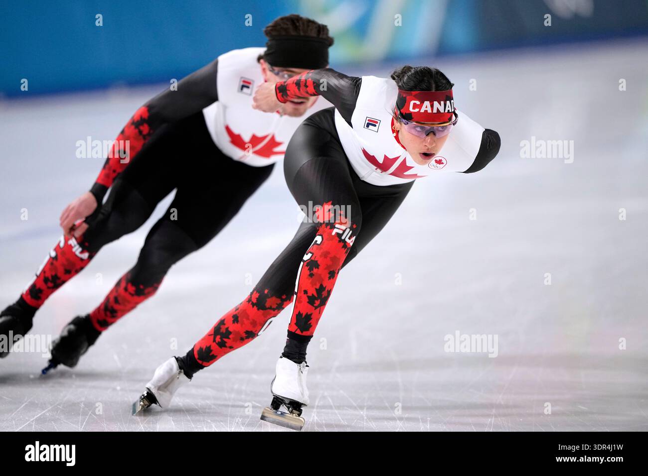 Speed skaters Beatrice Lamarche of Canada, right, and Cedrick Brunet of ...