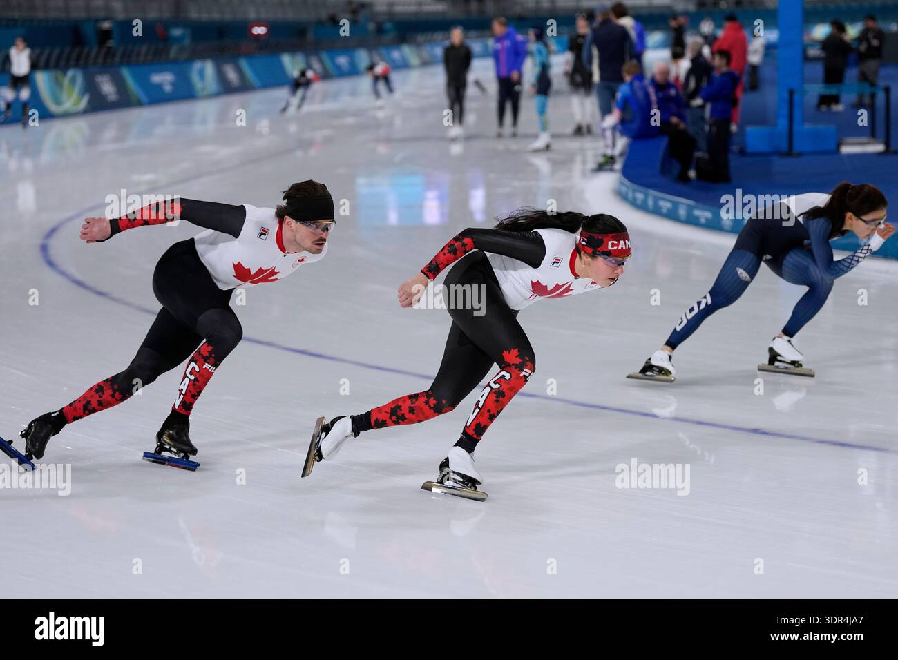 Speed skaters Beatrice Lamarche of Canada, center, and Cedrick Brunet ...