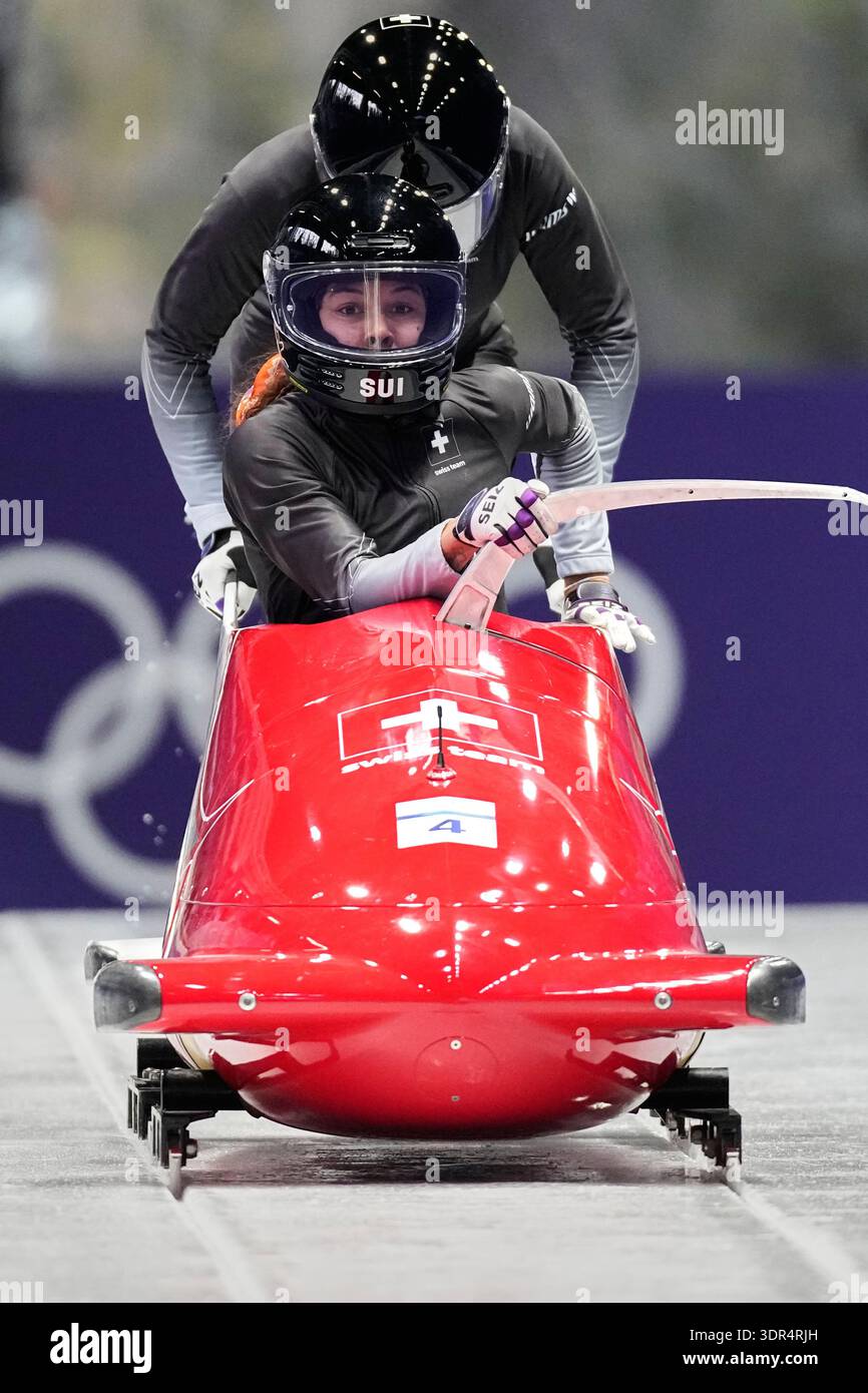 Switzerland's Melanie Hasler, front, starts for a two women bobsled ...