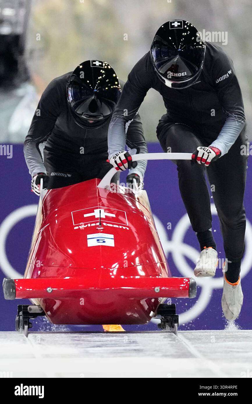Switzerland's Debora Annen, right, starts for a two women bobsled ...