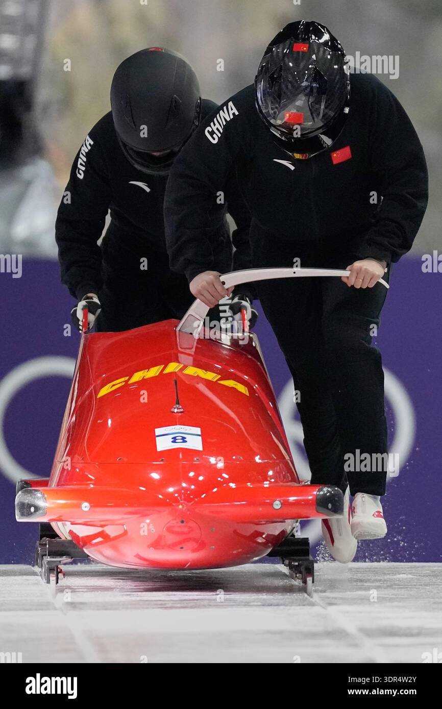 China's C, right, starts for a two women bobsled training session at ...