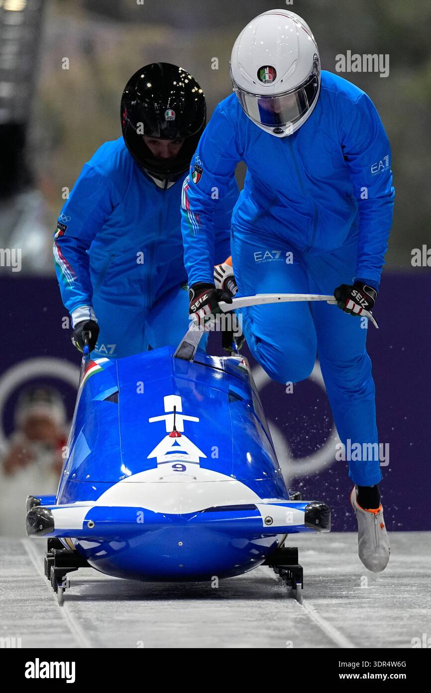 Italy's Giada Andreutti, right, starts for a two women bobsled training ...