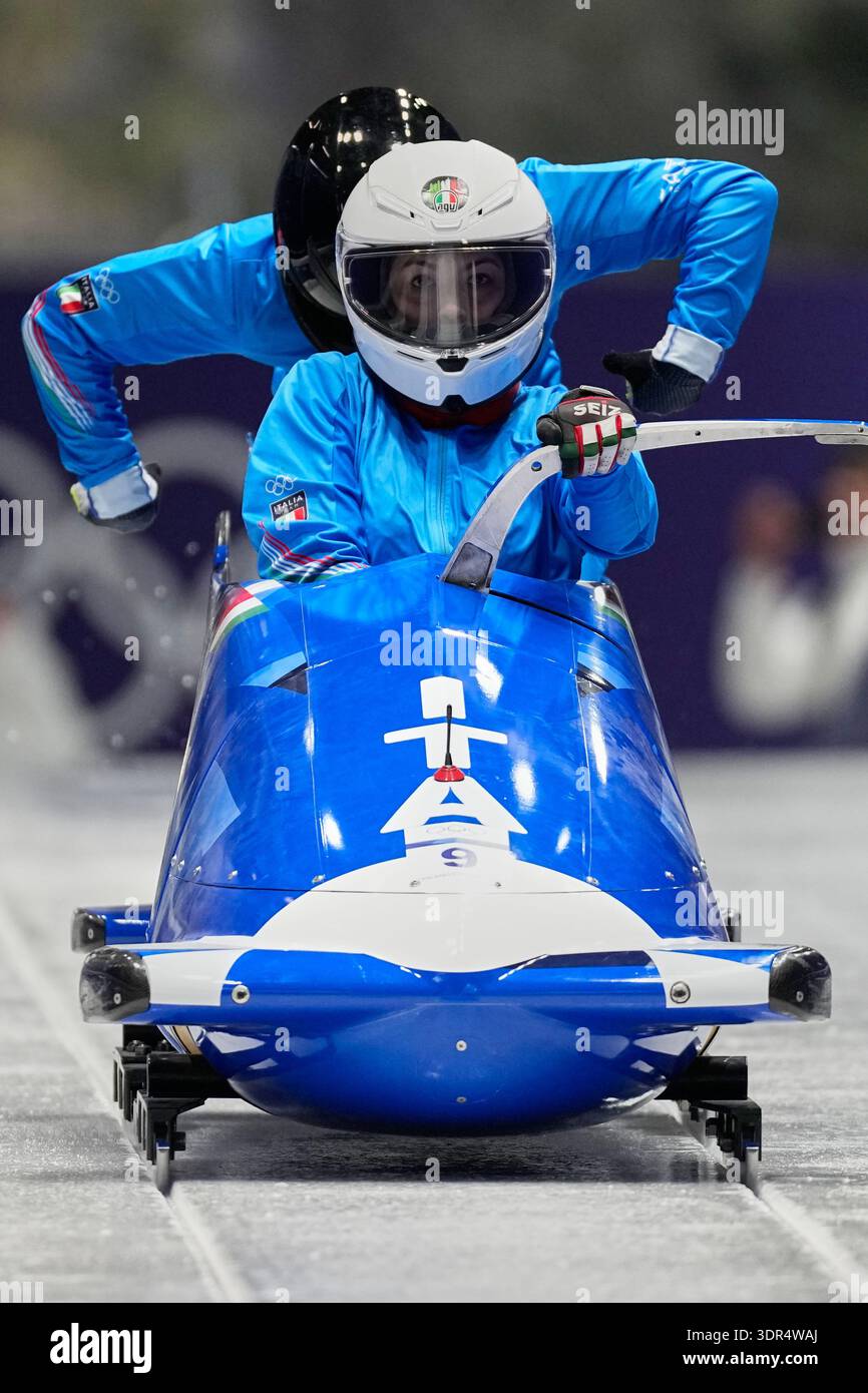 Italy's Giada Andreutti, front, starts for a two women bobsled training ...