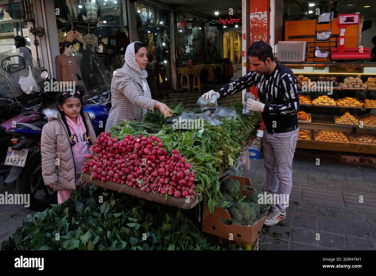 A woman shops vegetables at a bazaar in downtown Tehran, Iran, Tuesday ...