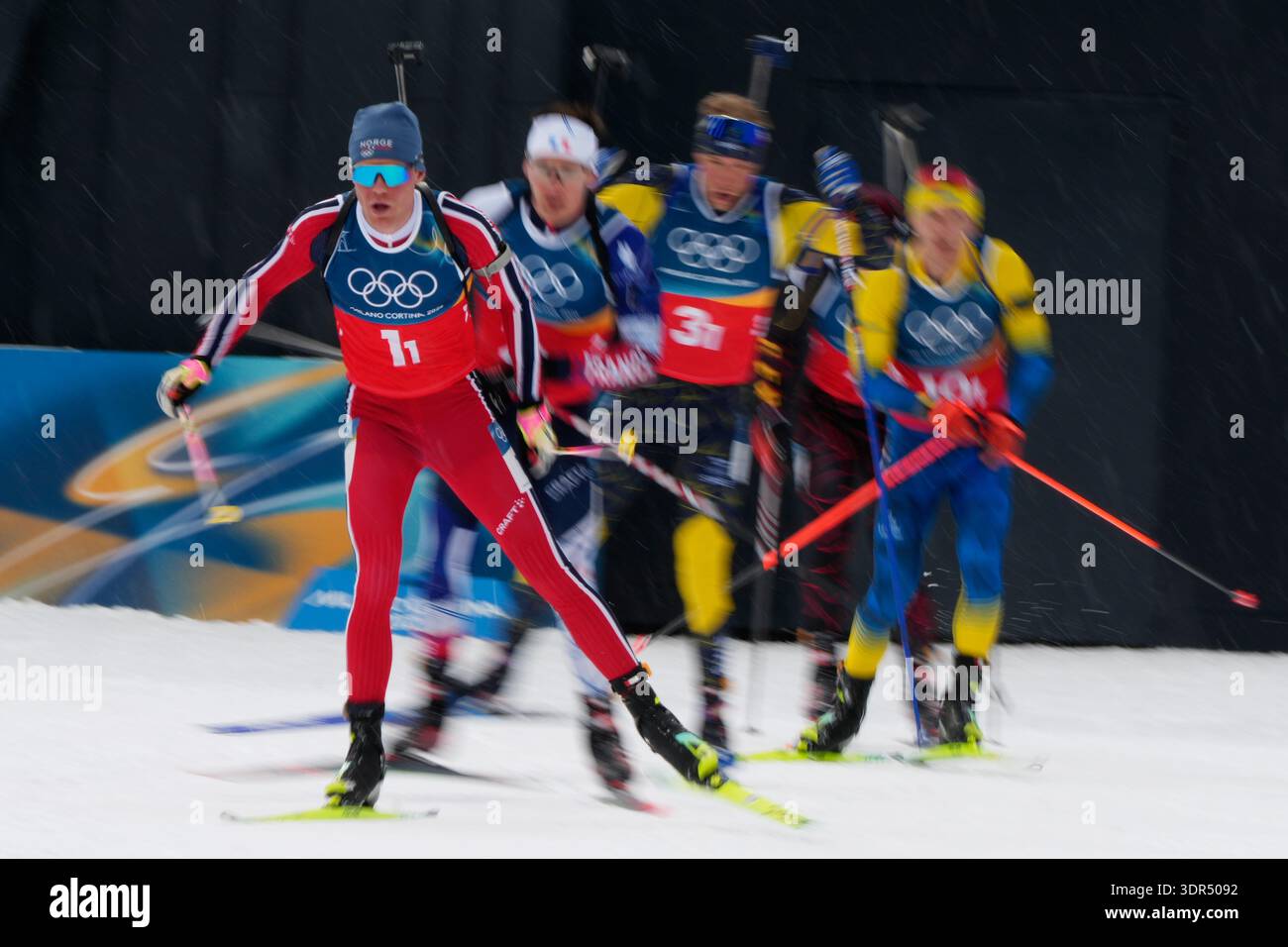 Martin Uldal, of Norway, skis in the men's 4x7.5-kilometer relay ...