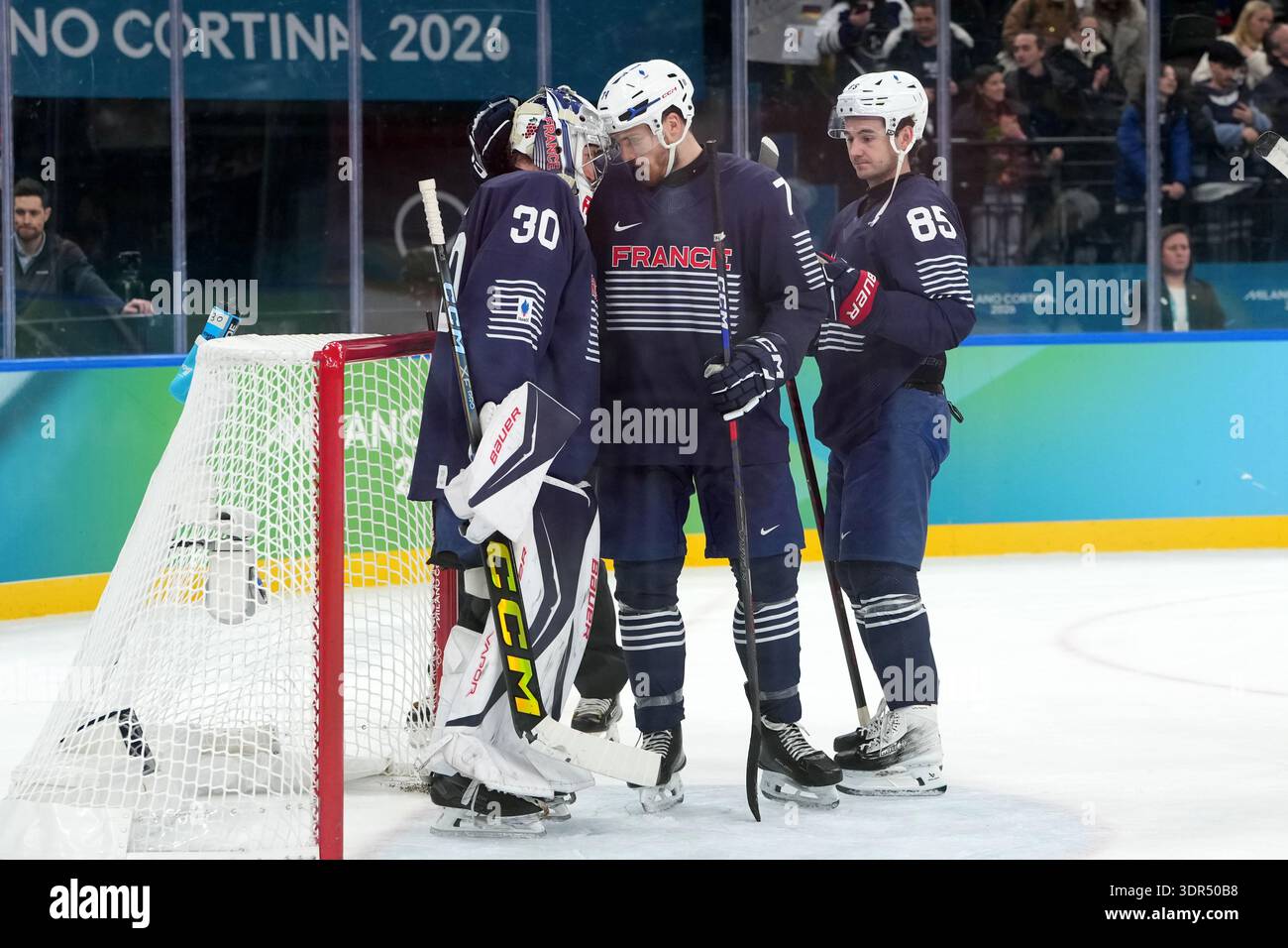 France's Pierre Crinon (7) consoles goalkeeper Antoine Keller (30 ...