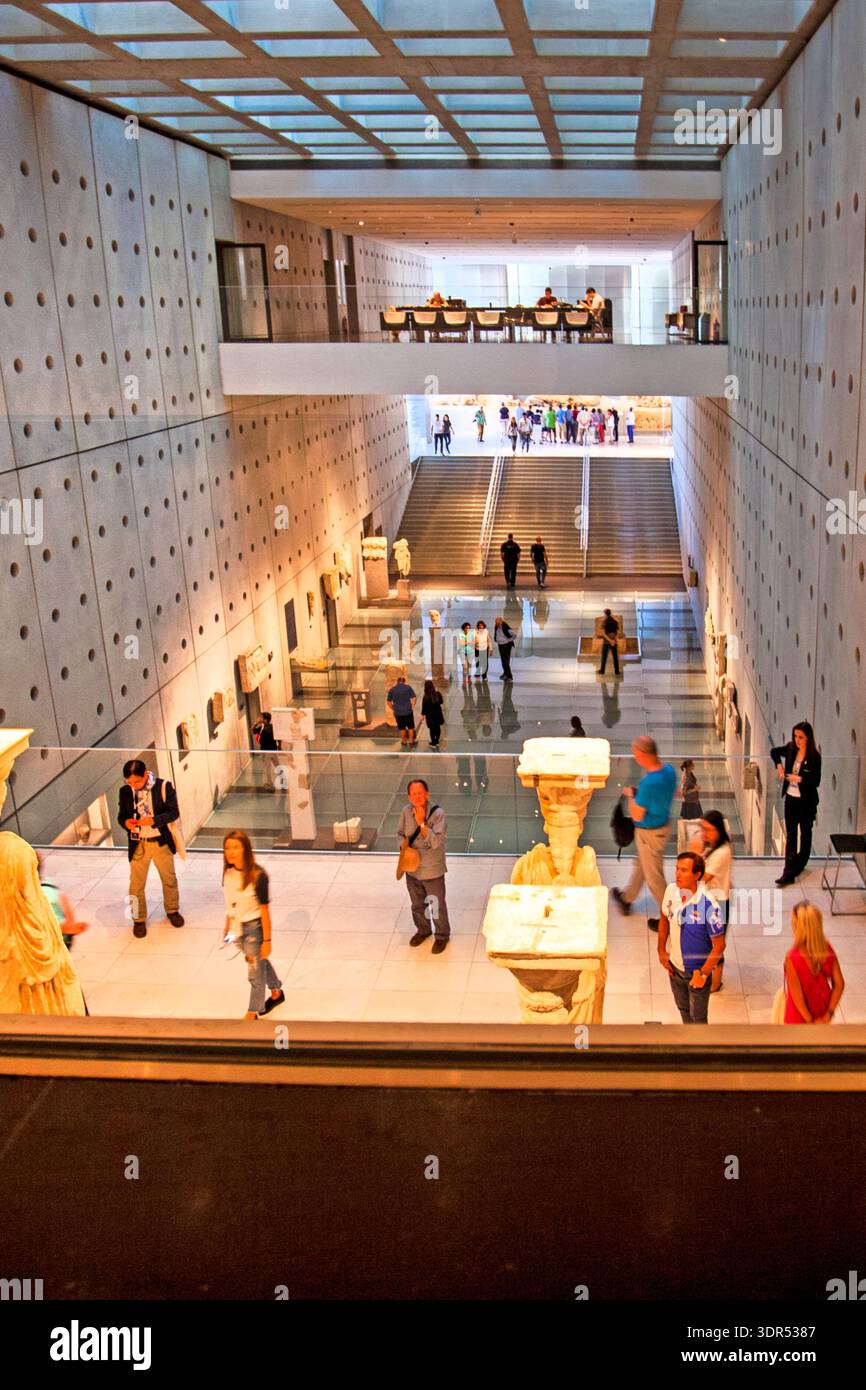 large, bright interior with ancient sculptures in the Athens museums ...