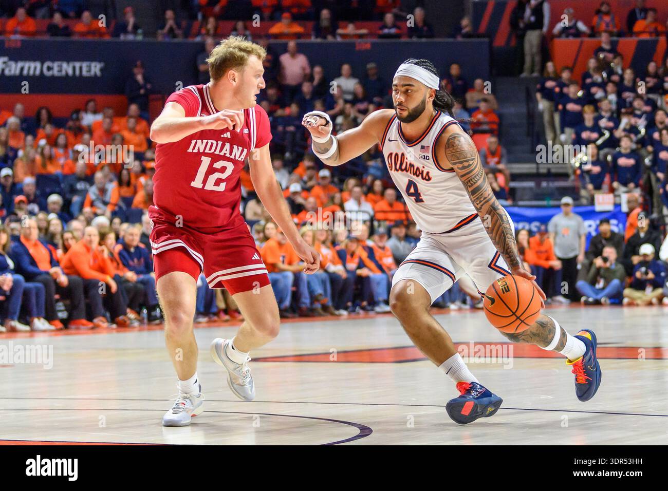 Illinois' Kylan Boswell drives against Indiana's Tucker DeVries during ...