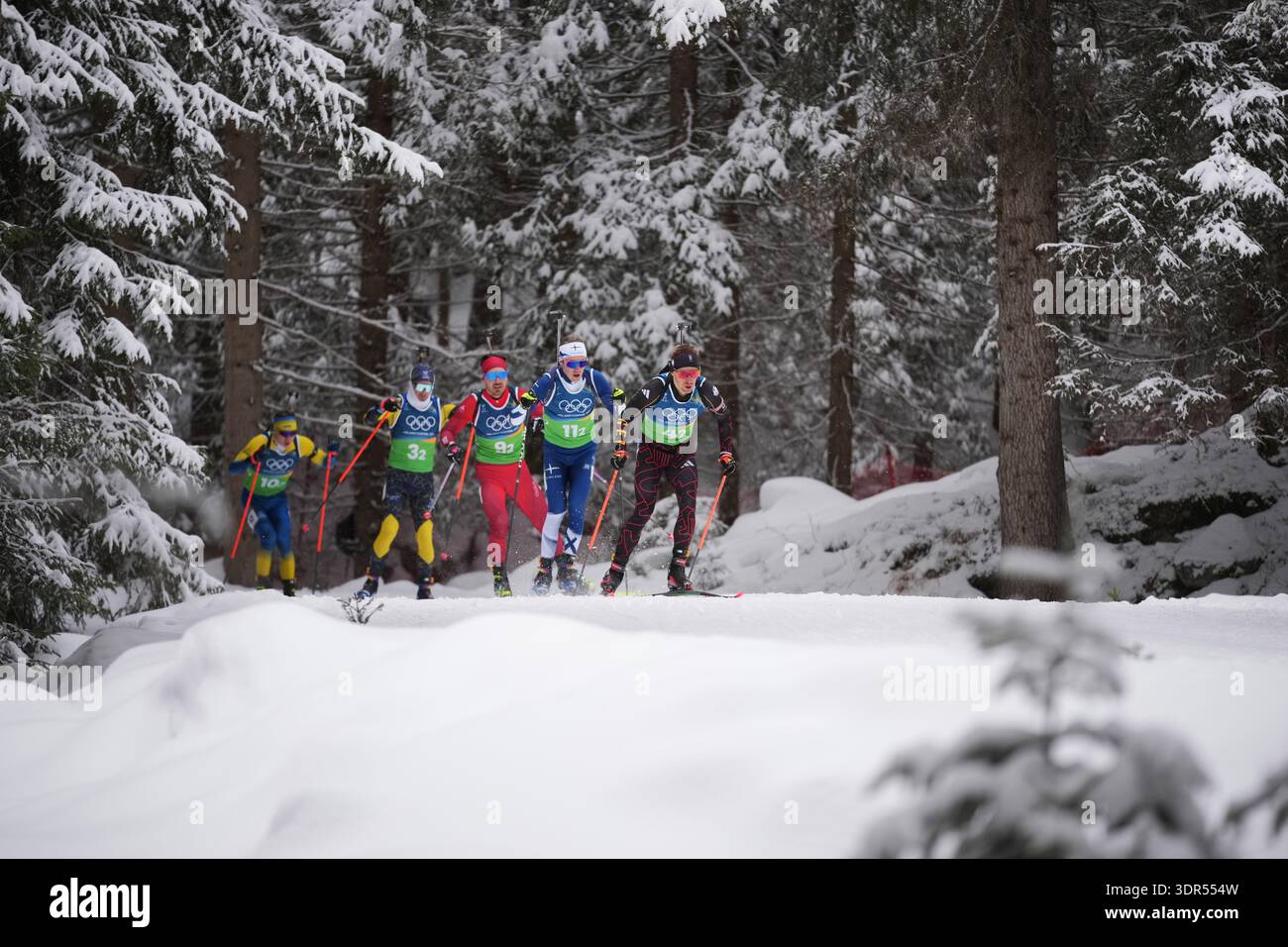 David Zobel, of Germany, leads a group in the men's 4x7.5-kilometer ...