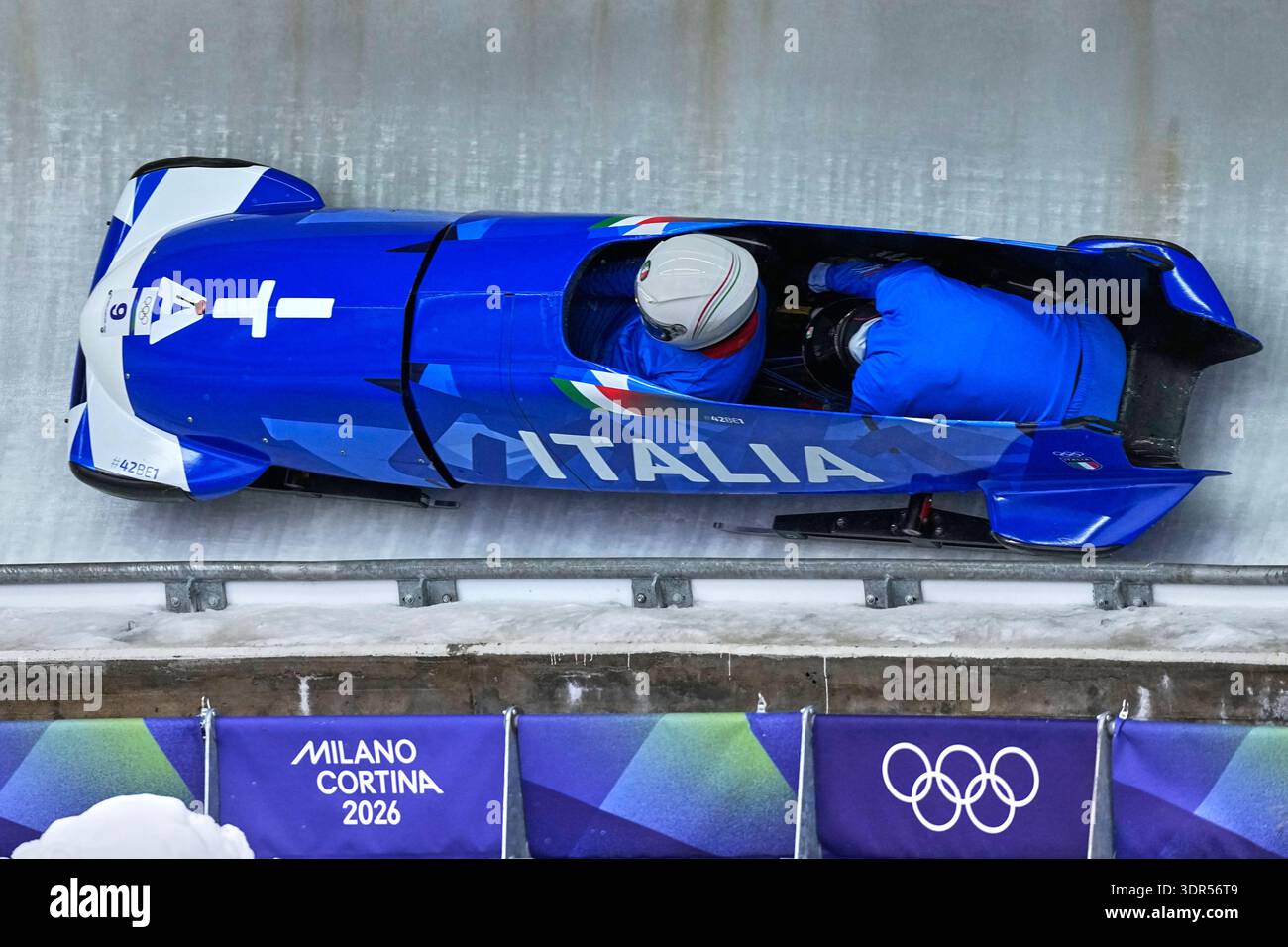 Italy's Giada Andreutti, left, slides down the track during a two women ...