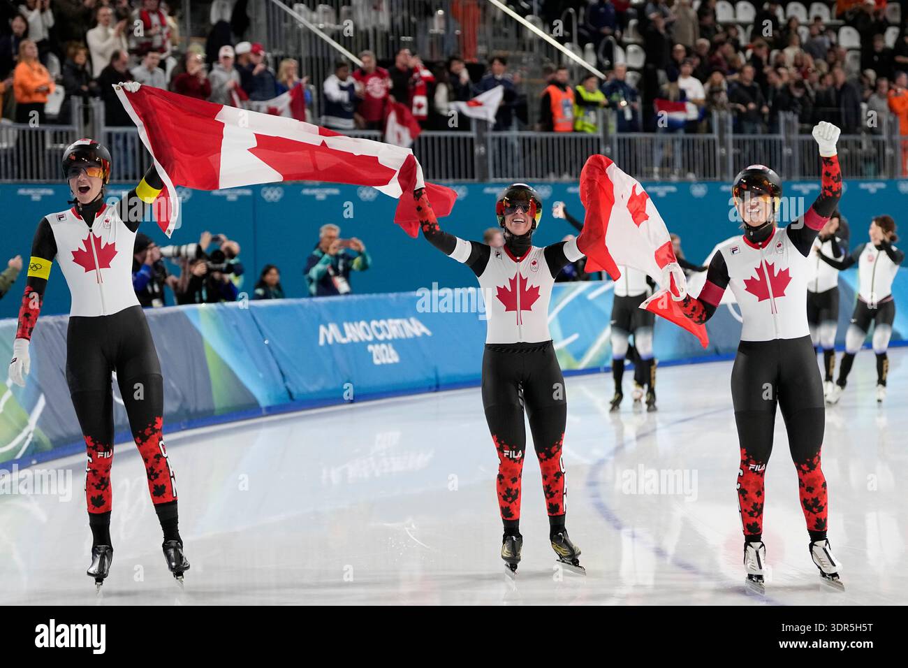 Team Canada with Ivanie Blondin, white armband, Valerie Maltais, red ...