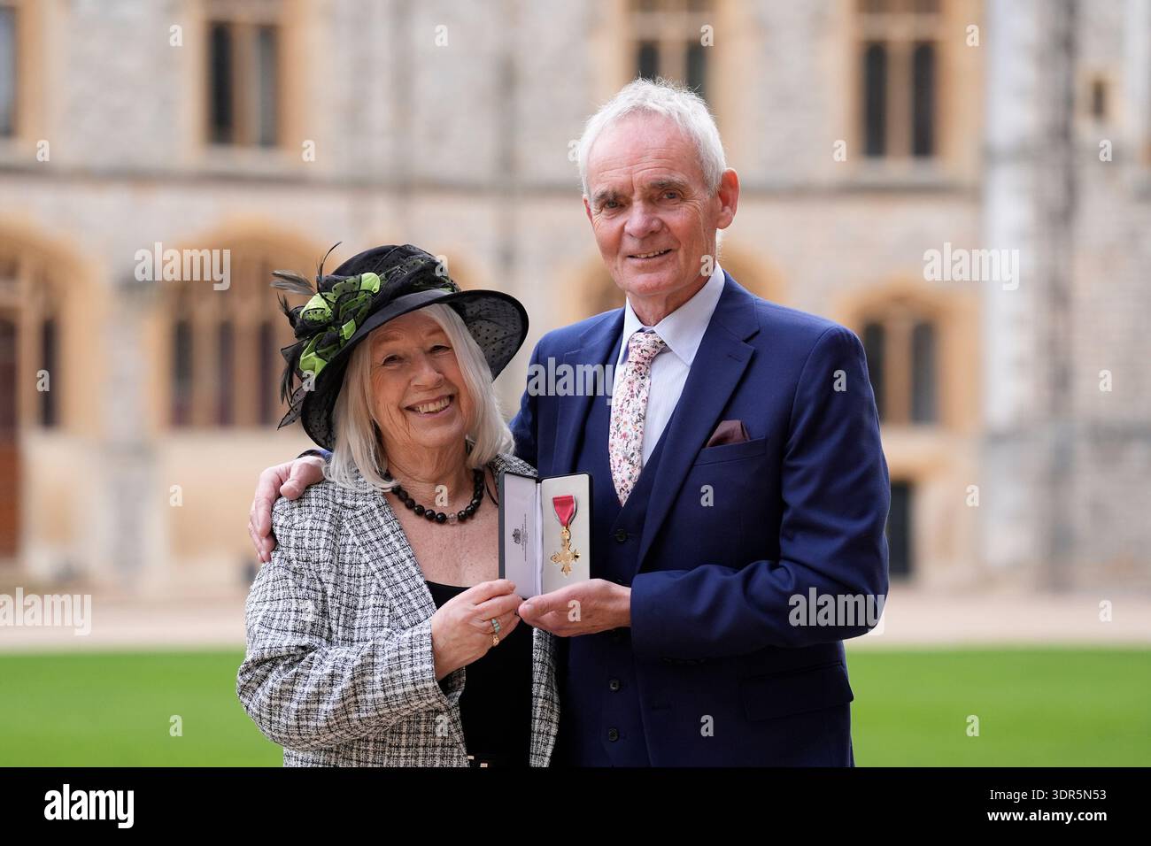 Richard Warren with his wife Carole after being made an Officer of the ...
