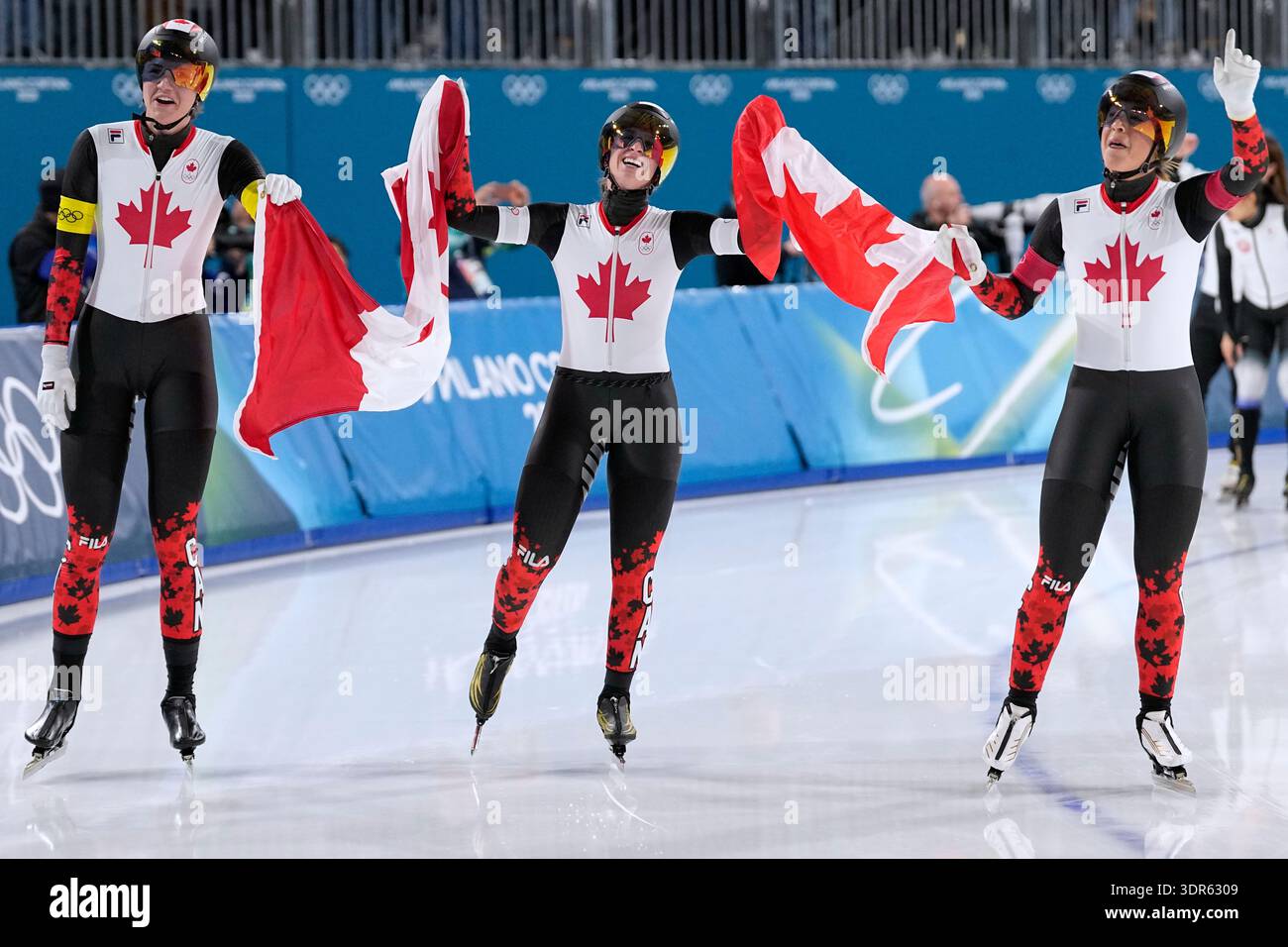 Team Canada with Ivanie Blondin, center, Valerie Maltais, right, and ...