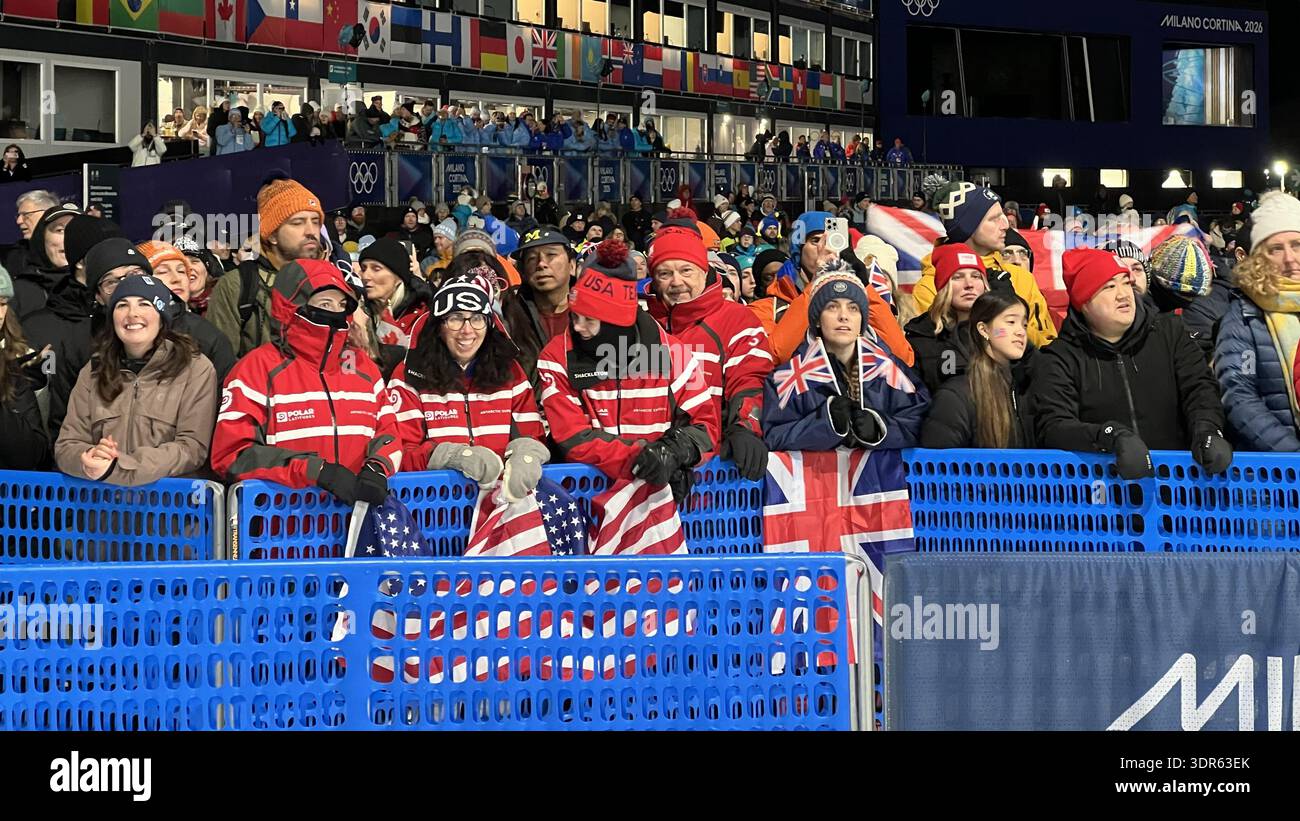 Livigno, Italy - February 15, 2026: Spectators with national flags ...
