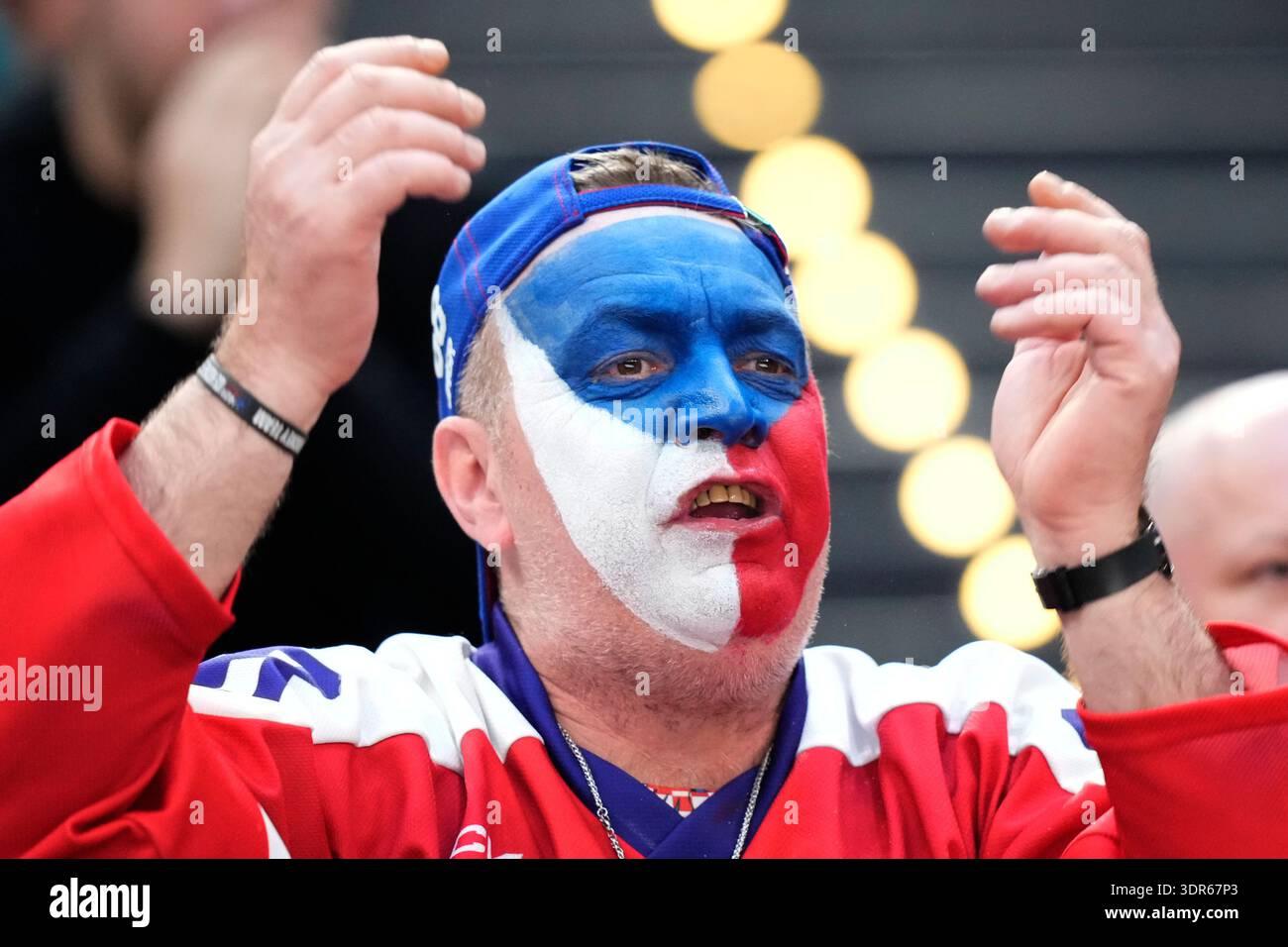 A Czechia fan watches the action during the third period of a men's ice ...