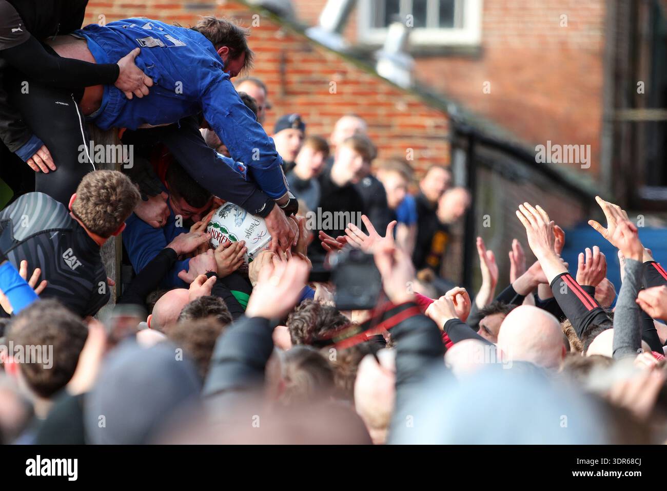 Ashbourne, United Kingdom. Players wrestle for possession during the ...