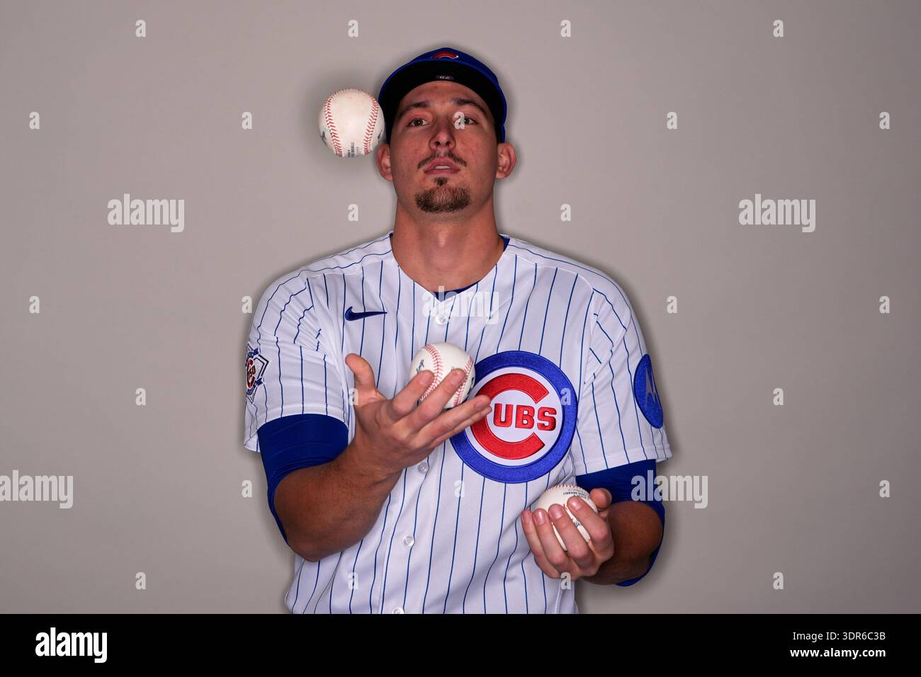 Chicago Cubs' Connor Schultz juggles some baseballs at the team's photo ...