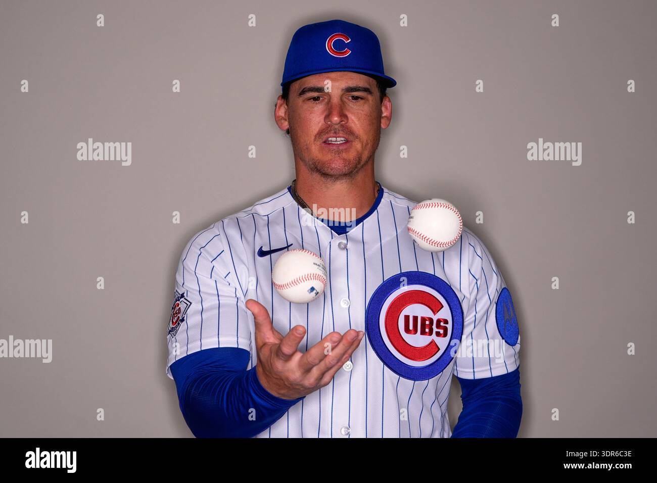 Chicago Cubs' Tyler Austin juggles some baseballs at the team's photo ...