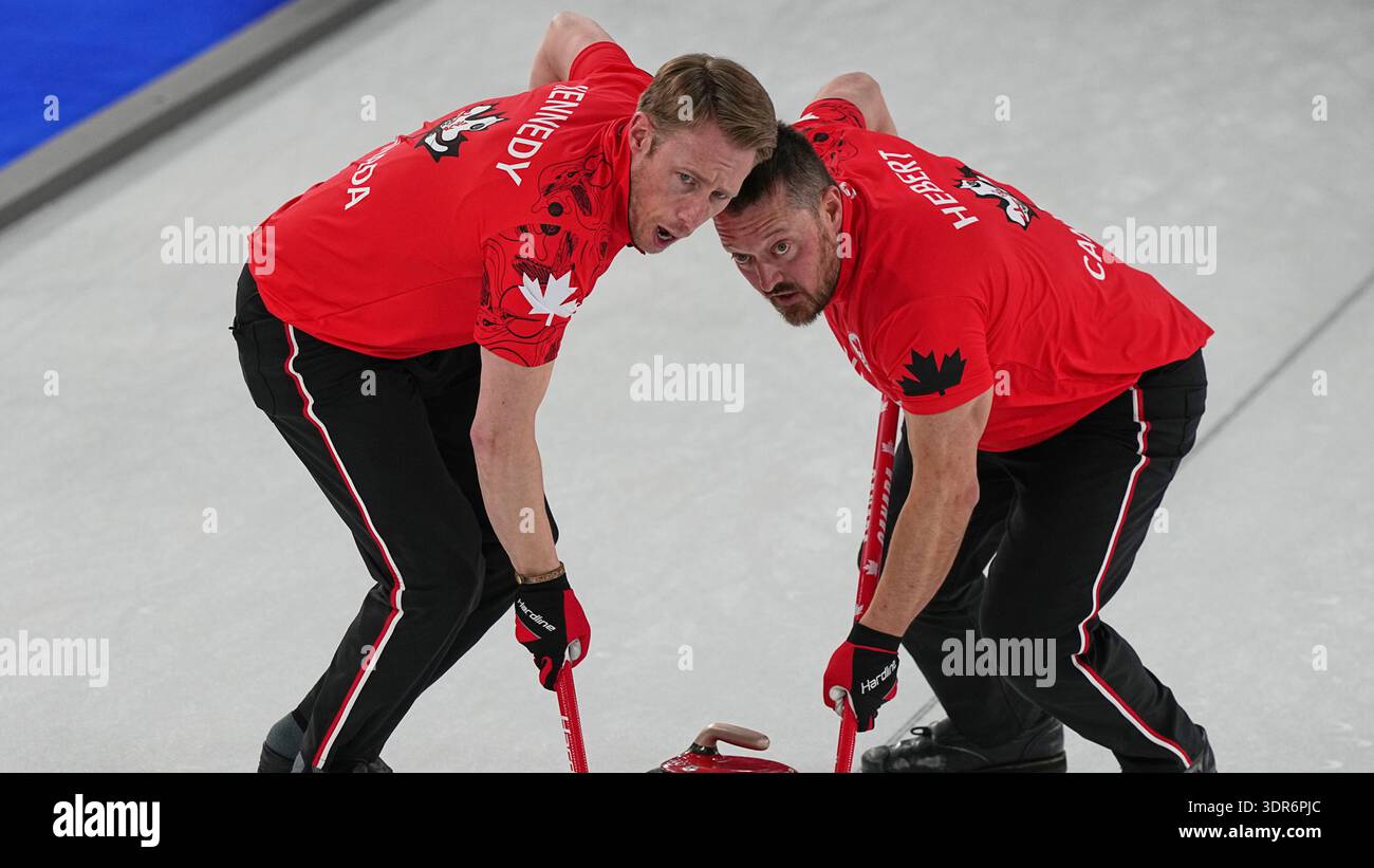 Canada's Marc Kennedy and Ben Hebert in action during the men's curling ...