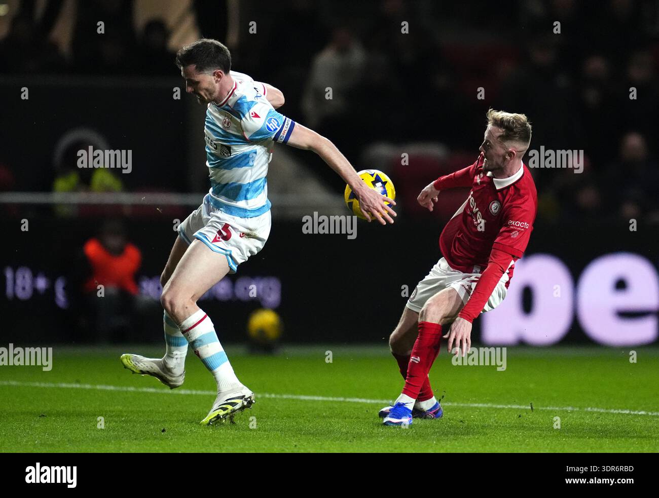 Wrexham's Dominic Hyam (left) and Bristol City's Mark Sykes in action ...