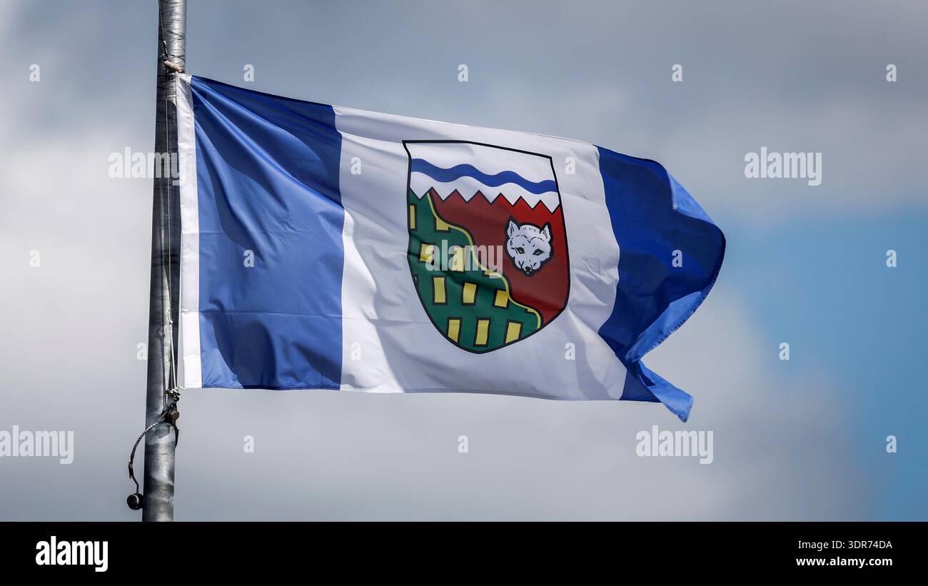 A Northwest Territories flag flaps in the breeze at Yellowknife Airport ...