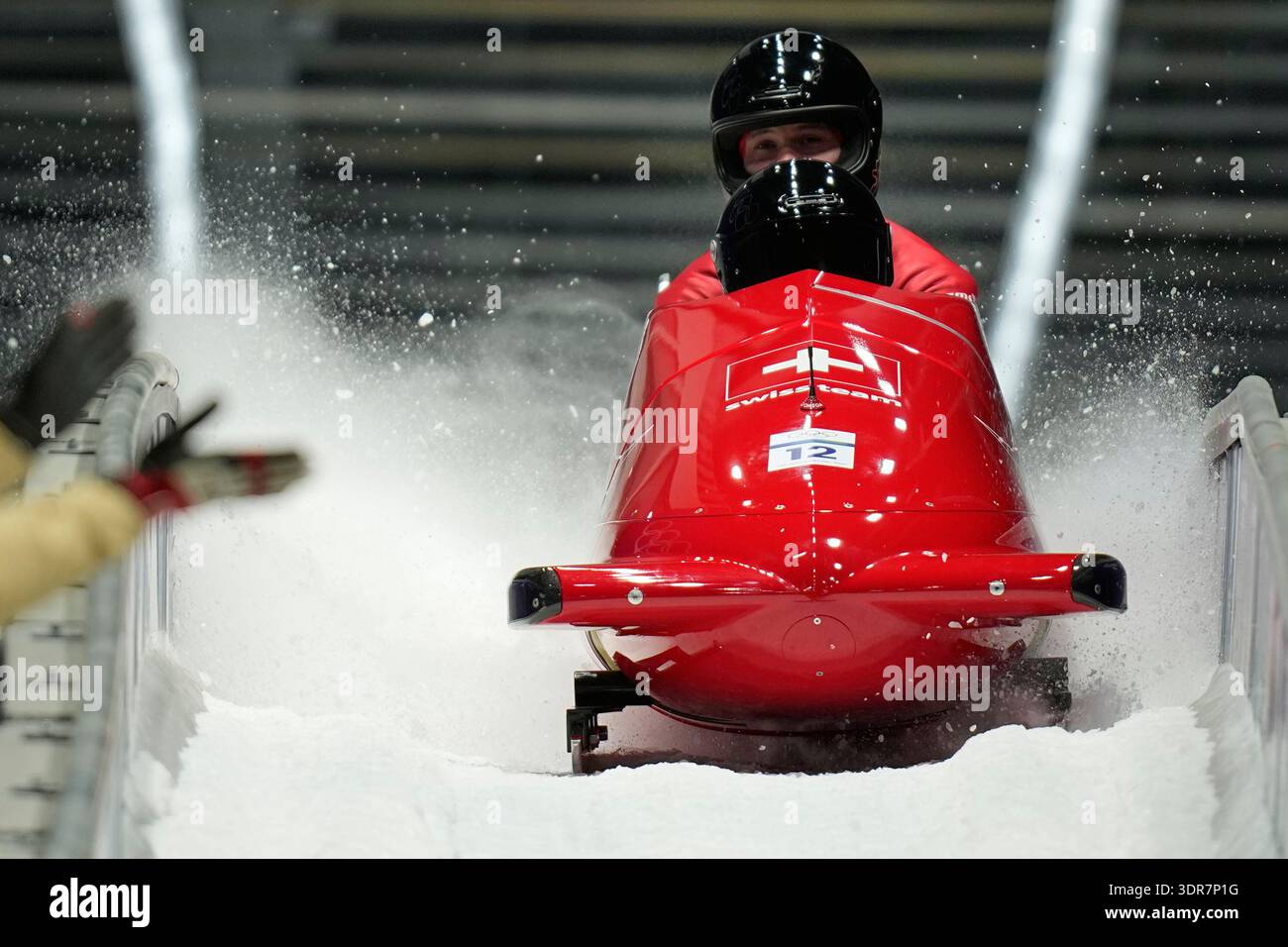 Switzerland's Cedric Follador and Luca Rolli arrive at the finish ...