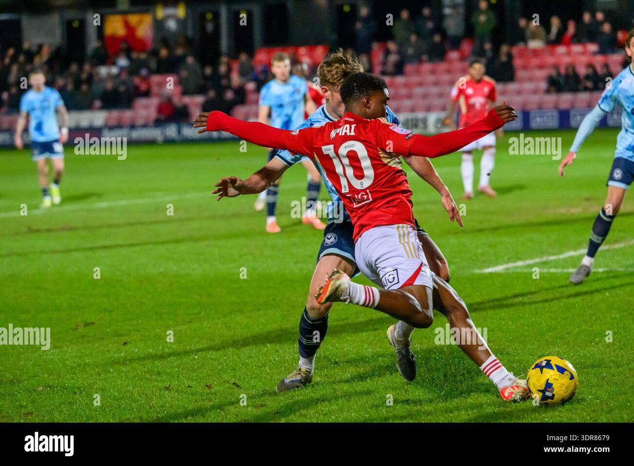 Tom Davies of Newport County tackles Kelly Nmai of Salford City FC ...