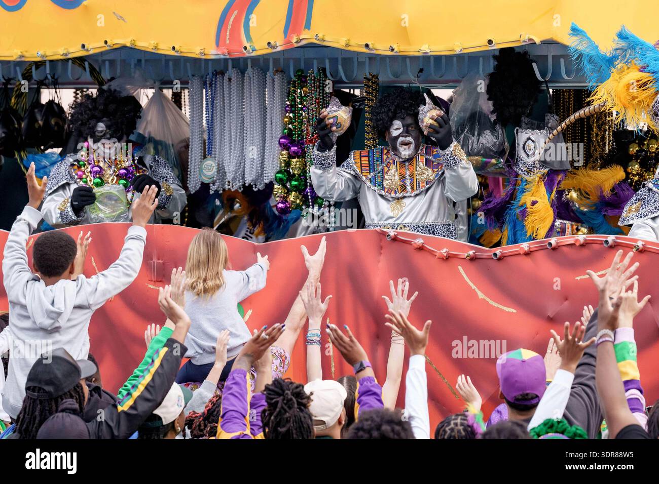 Revelers participate during Mardi Gras Day, Tuesday, Feb. 17, 2026 in ...