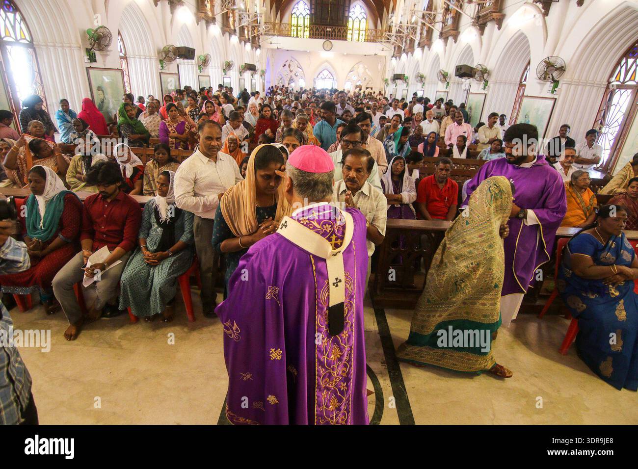 Chennai, India. 18th Feb, 2026. Catholic devotees offer prayers during ...